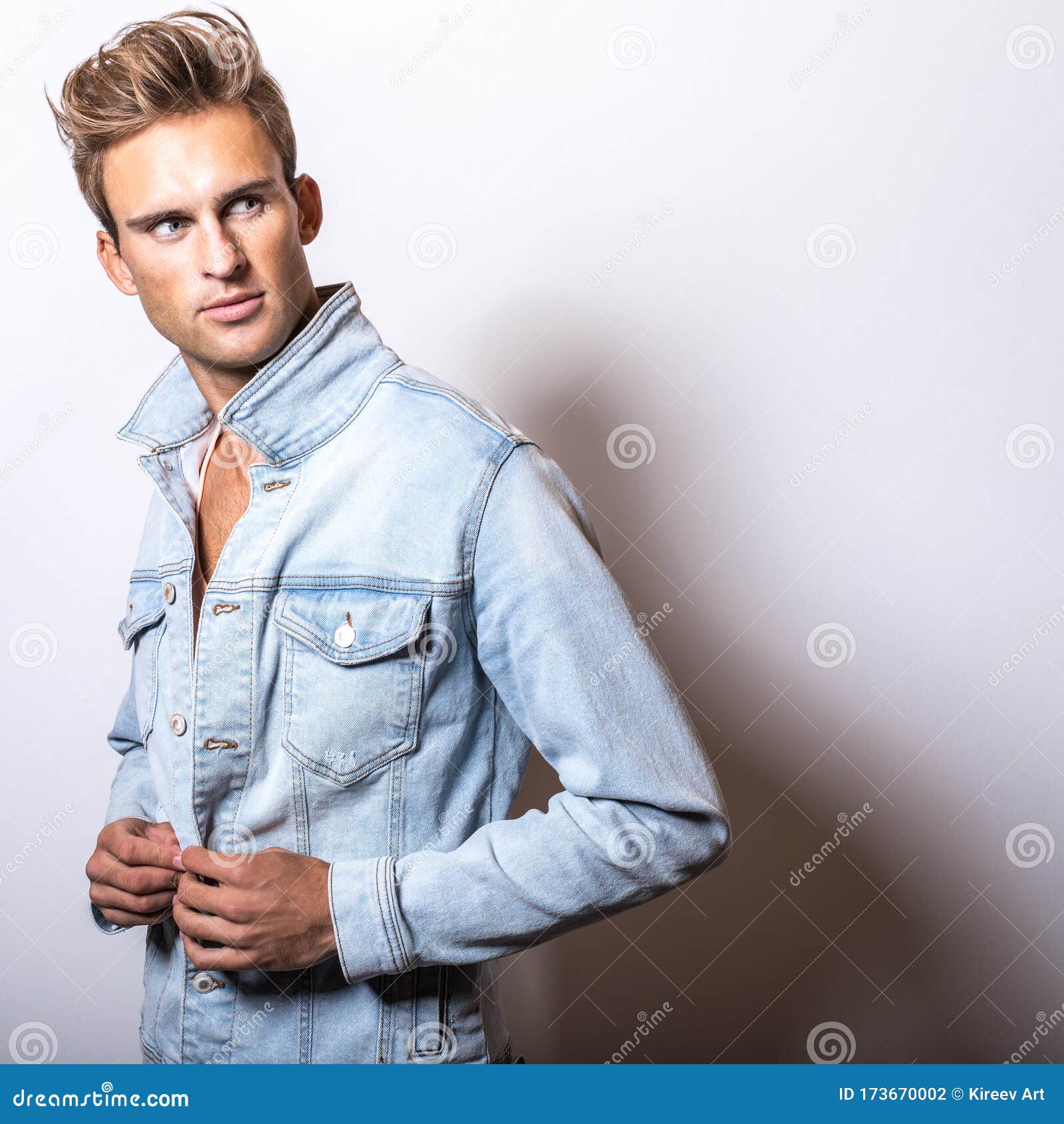 Handsome Young Man in Jeans Jacket Pose in Studio. Stock Photo - Image ...