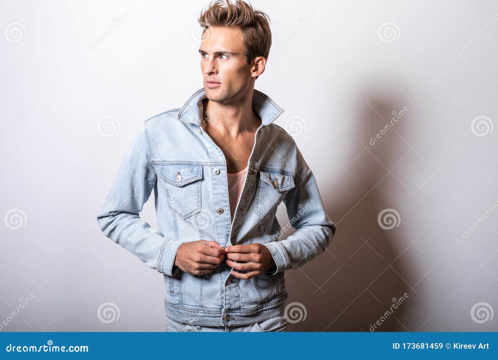 Handsome Young Man in Jeans Jacket Pose in Studio. Stock Image - Image ...