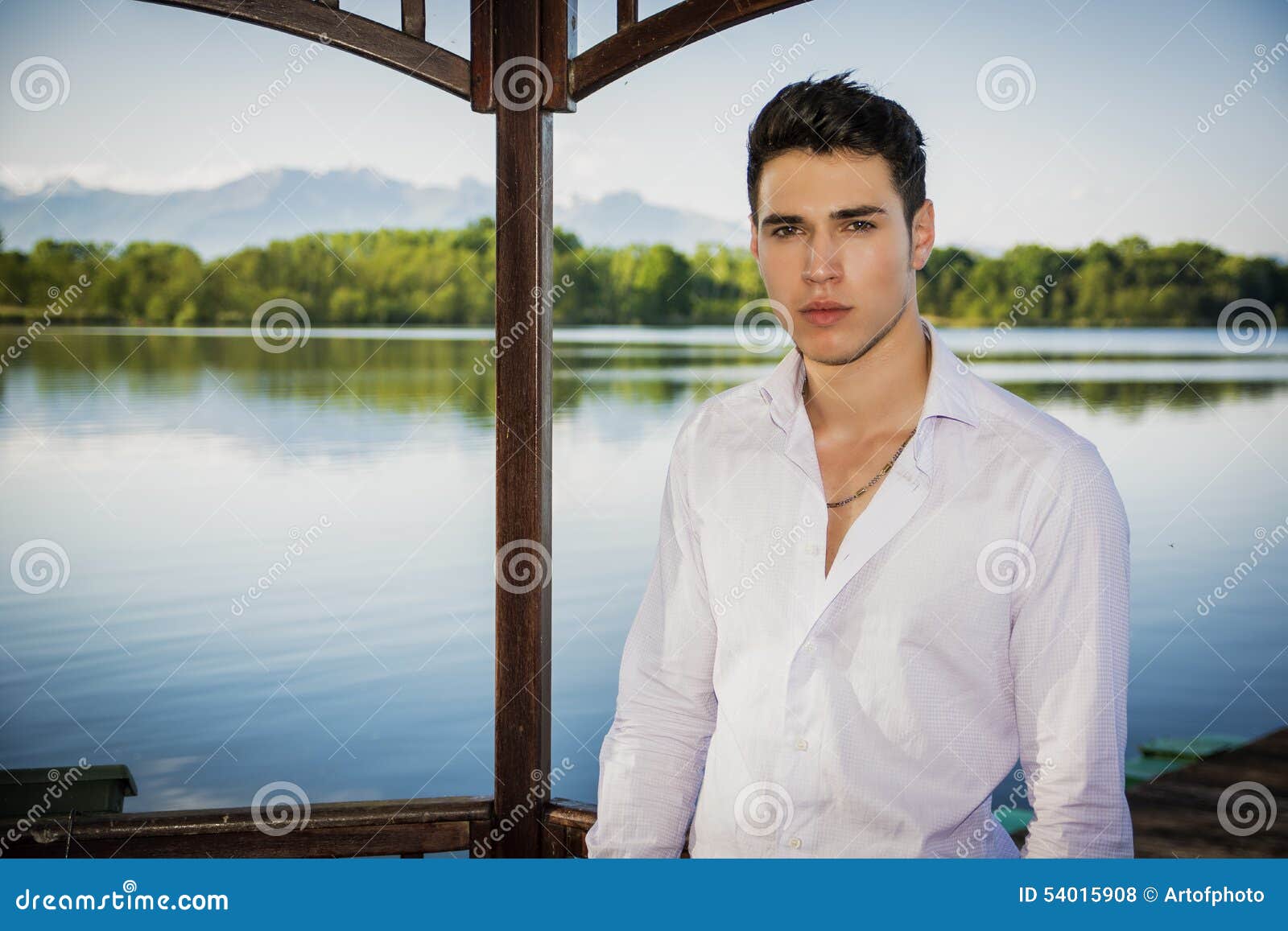 Handsome Young Man on a Lake in a Sunny, Peaceful Stock Photo - Image ...
