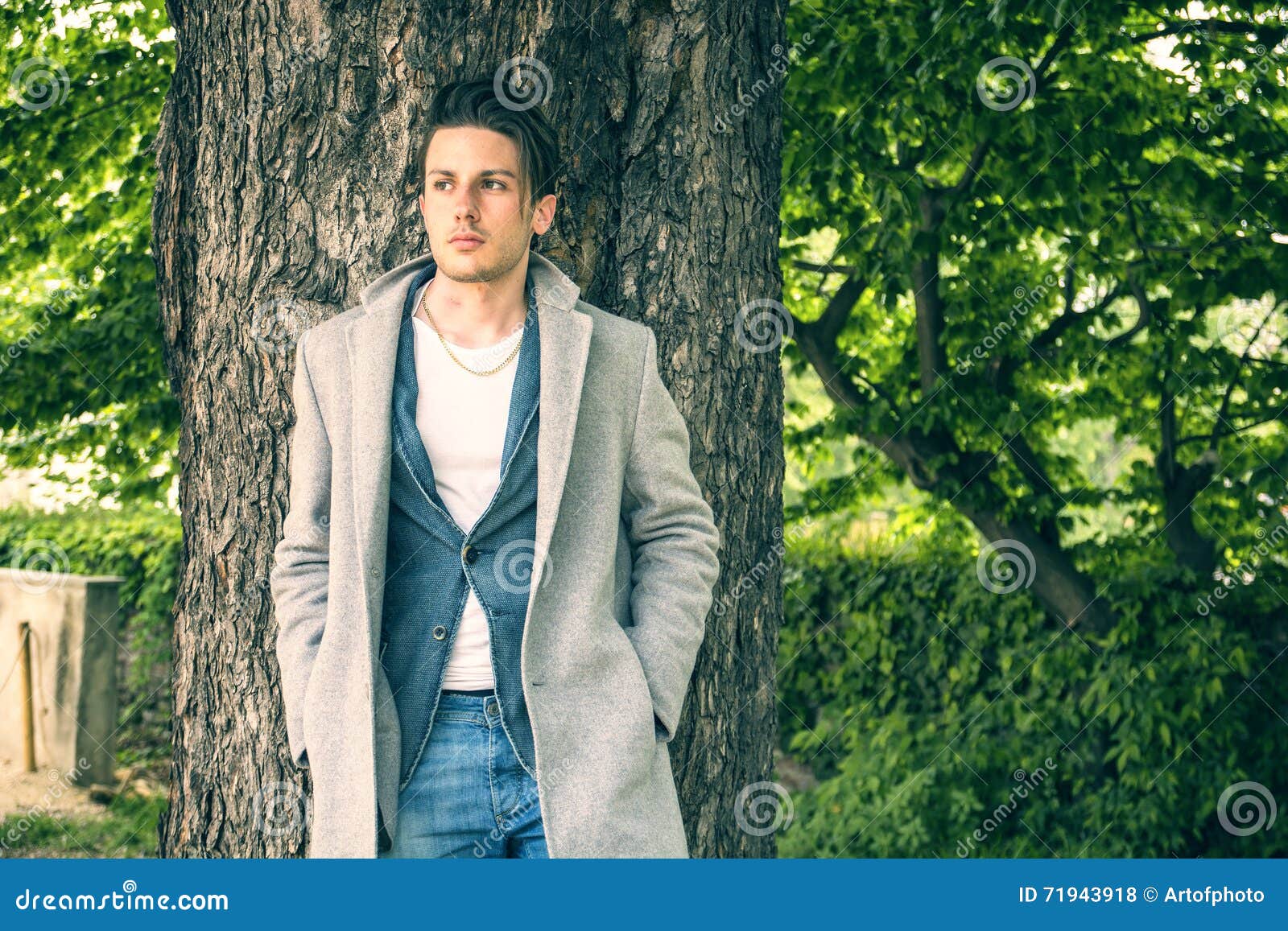 Handsome Young Man Leaning Against Tree Stock Photo - Image of male ...