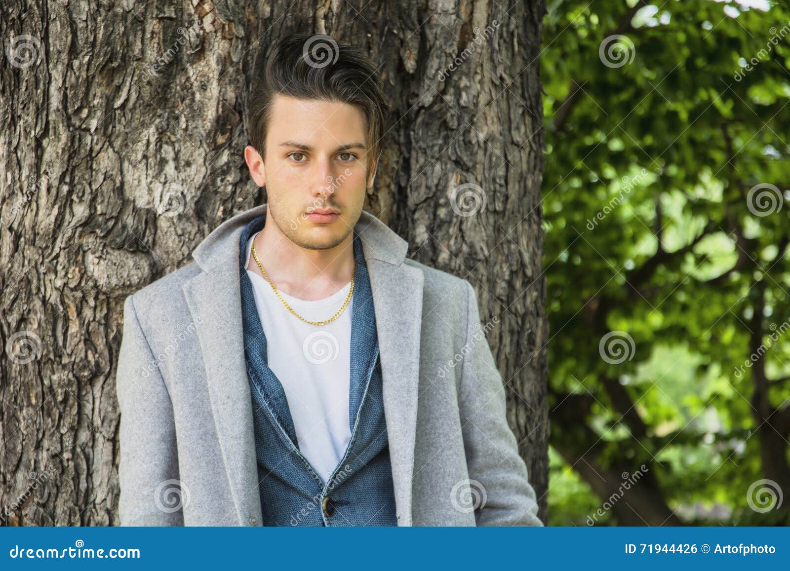 Handsome Young Man Leaning Against Tree Stock Photo - Image of male ...