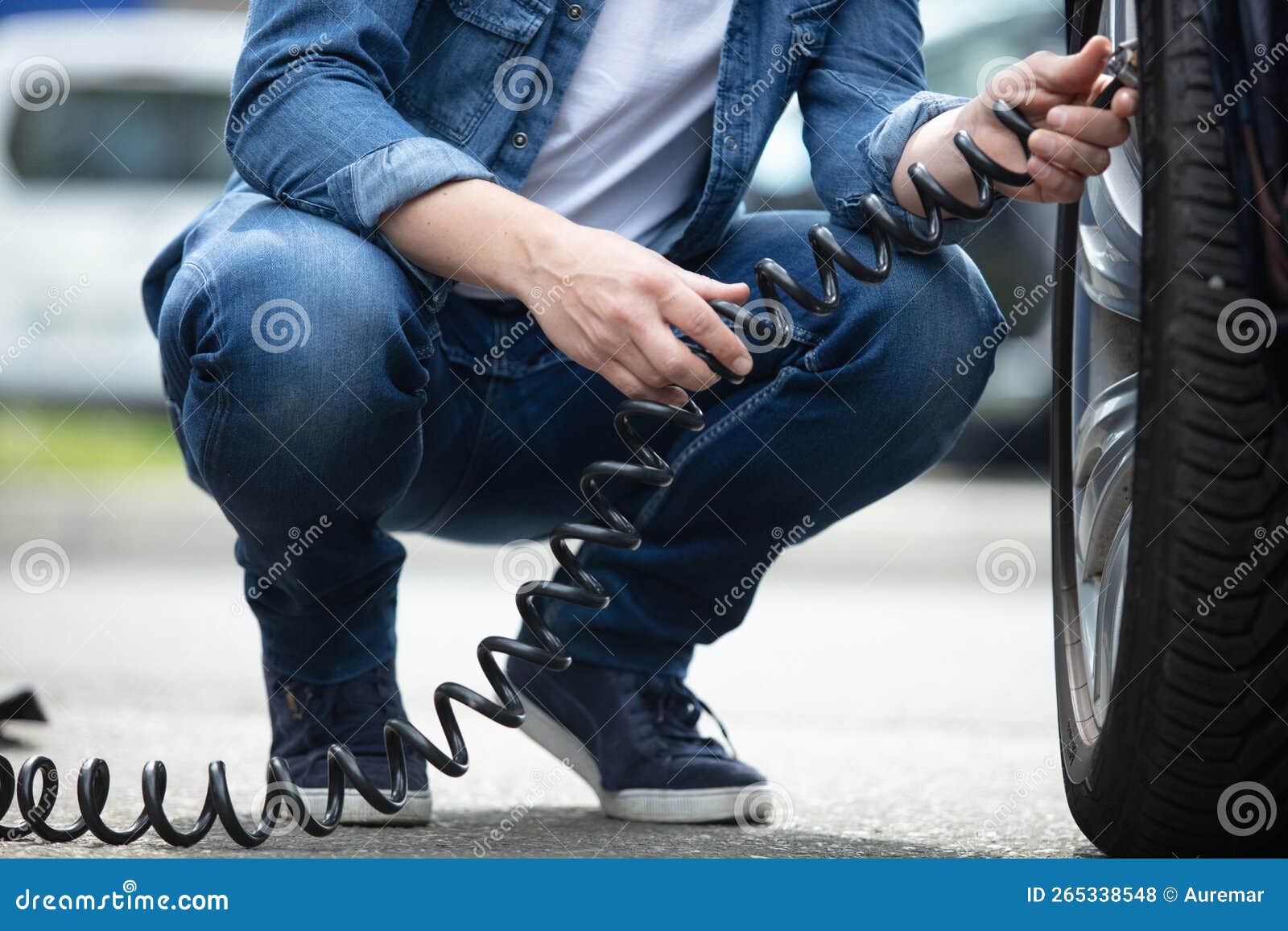 Handsome Young Man Lifting Car Stock Photo - Image of alone, lifestyle ...