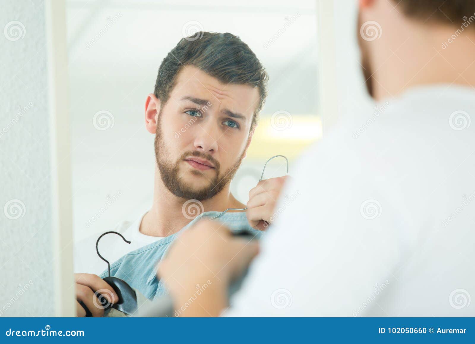 Handsome Young Man Looking at Himself in Mirror Stock Photo - Image of ...