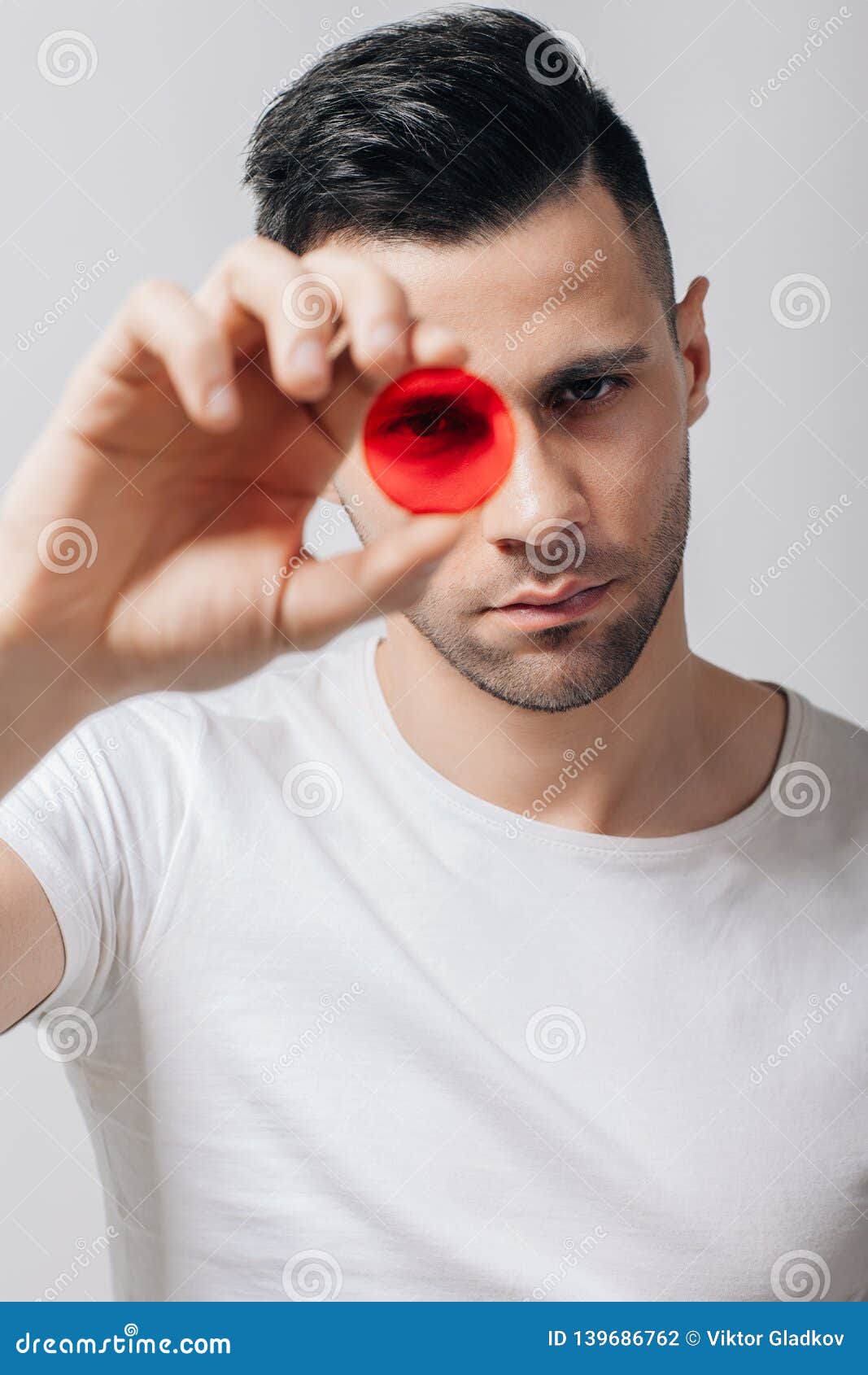 Handsome Young Man Looking through Red Glass Stock Photo - Image of ...