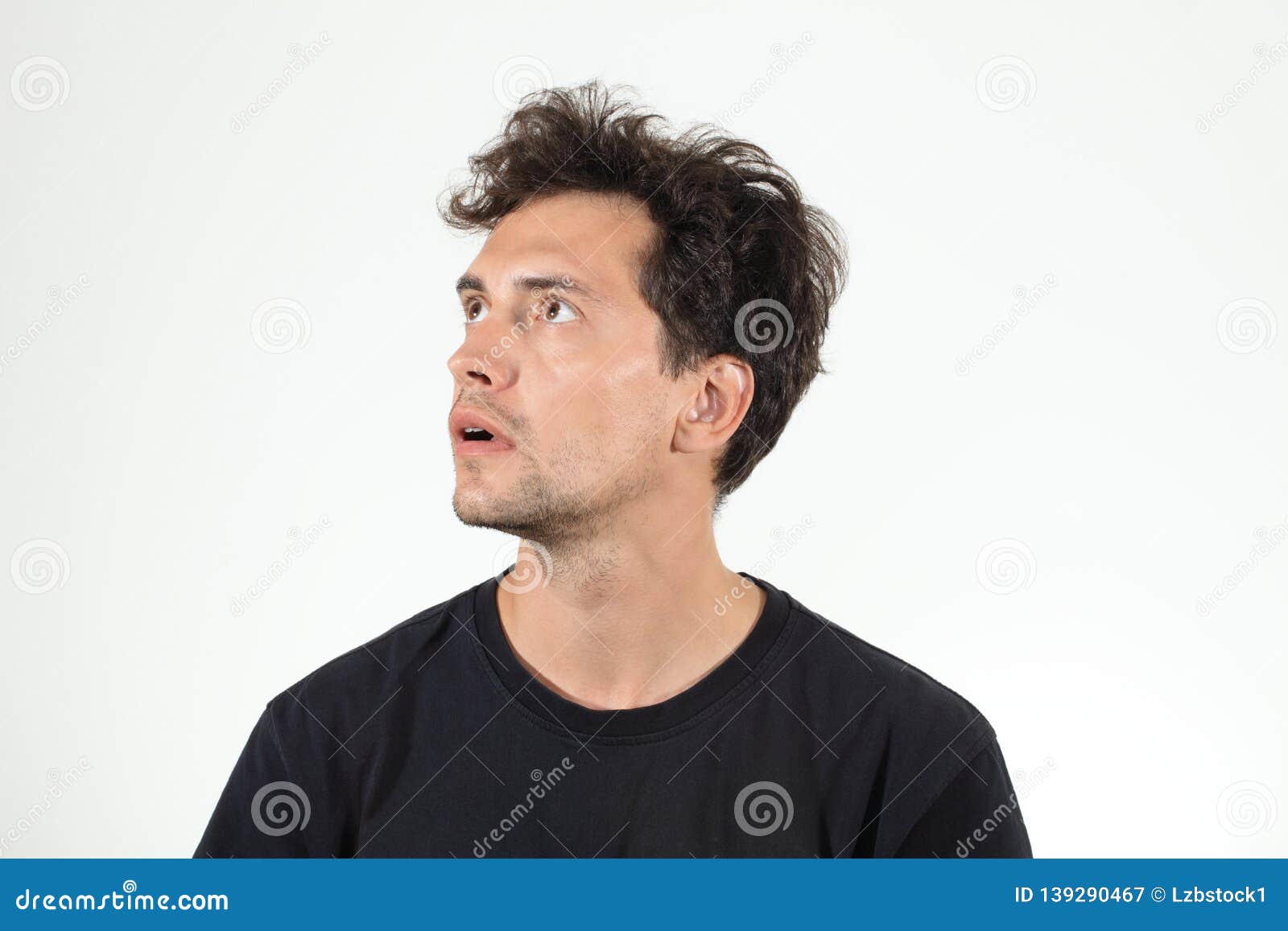 Handsome Young Man Looking Right Up and Opening His Mouth, Isolated ... Handsome Young Man Looking Right Up and Opening His Mouth, Isolated ...