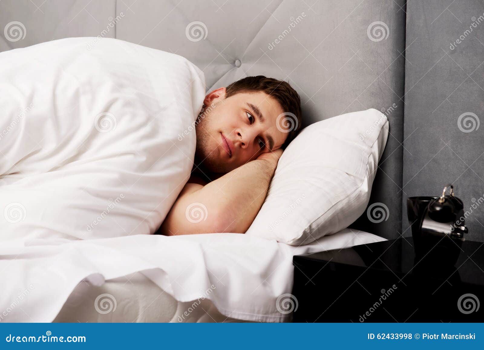 Handsome Young Man Lying in Bed. Stock Photo - Image of happy, face ...