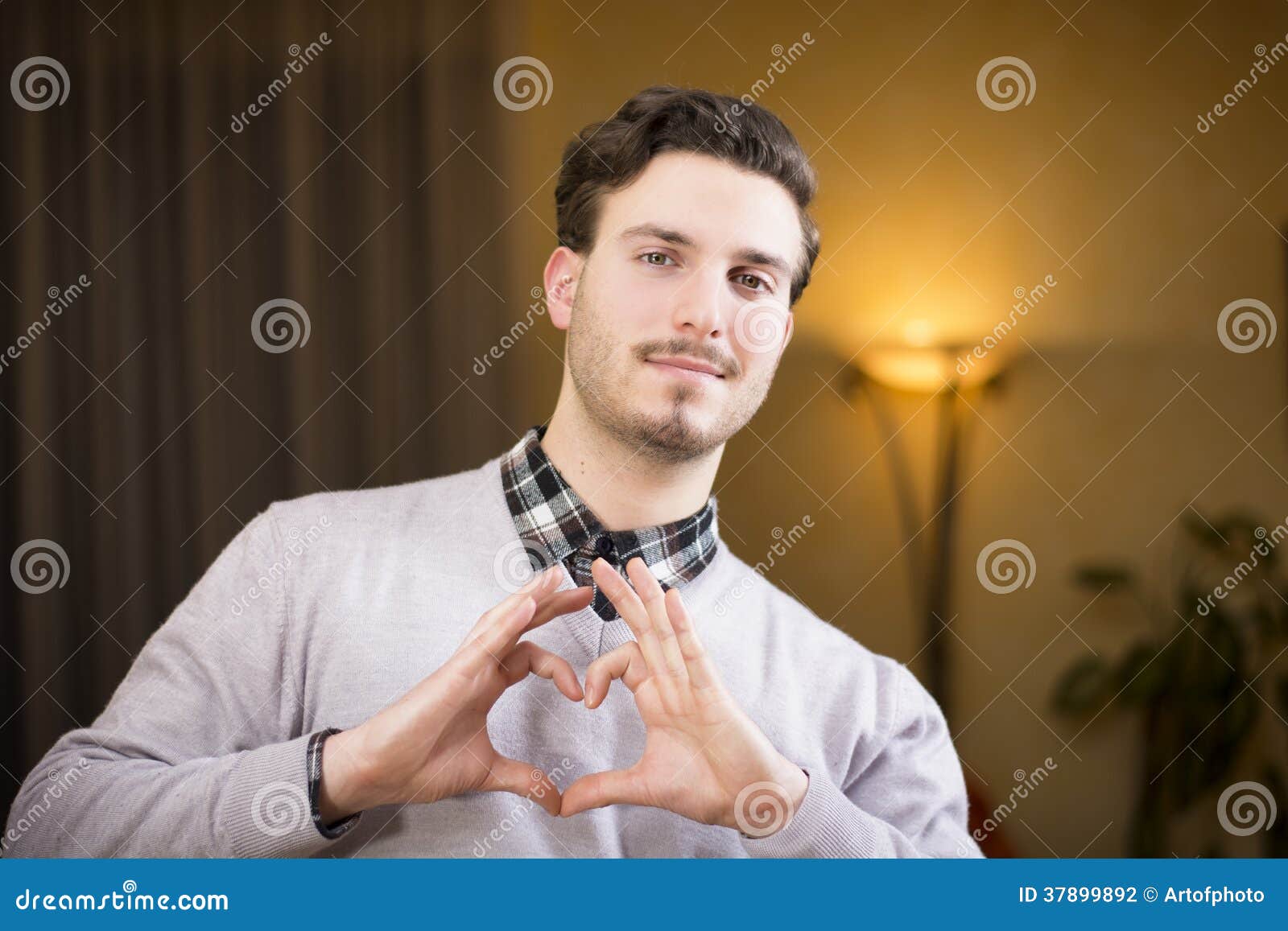 Handsome Young Man Making Heart Sign with Hands Stock Photo - Image of ...