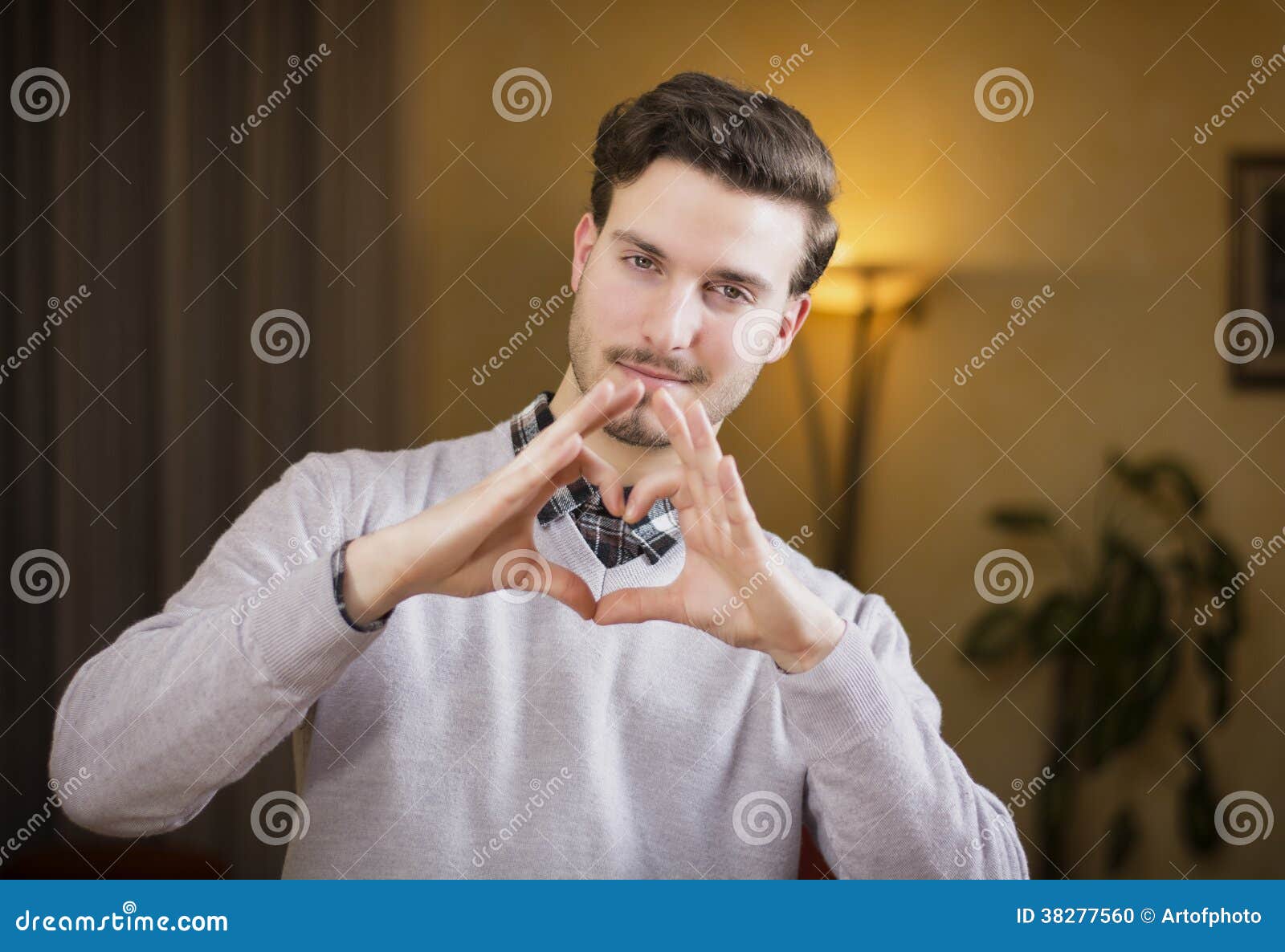 Handsome Young Man Making Heart Sign with His Hands Stock Photo - Image ...