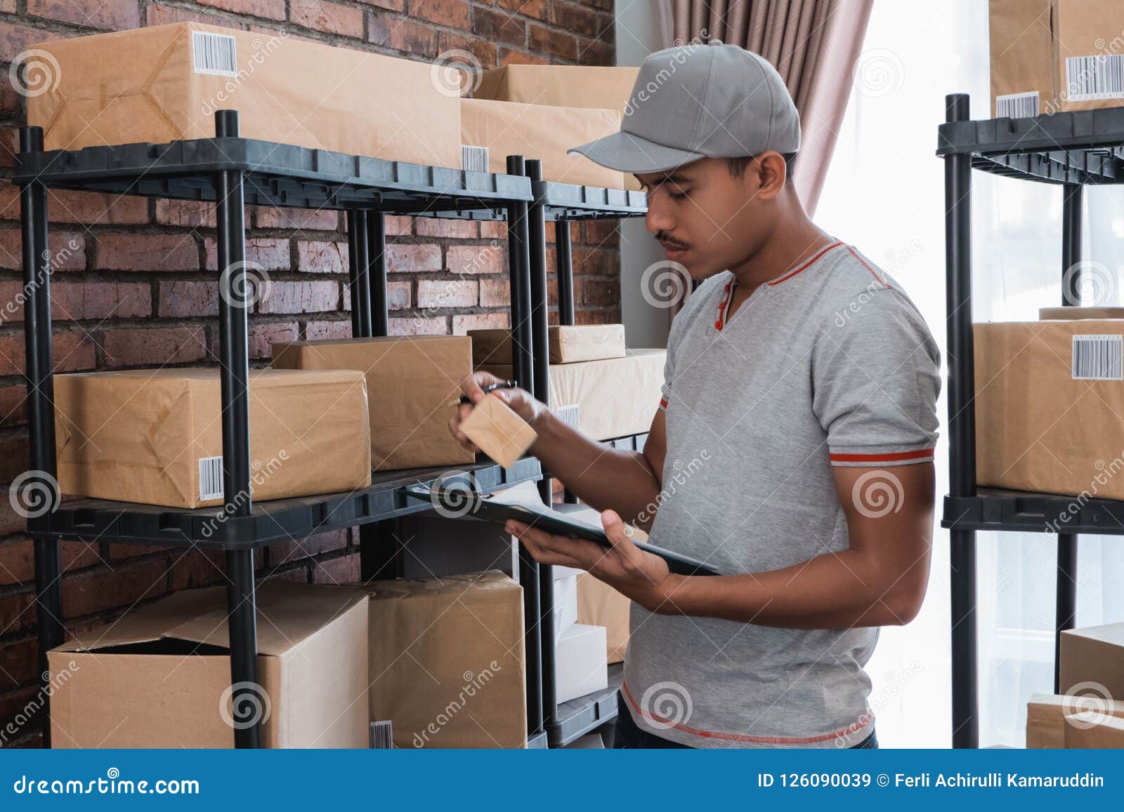 Man checking packages stock image. Image of package - 126090039