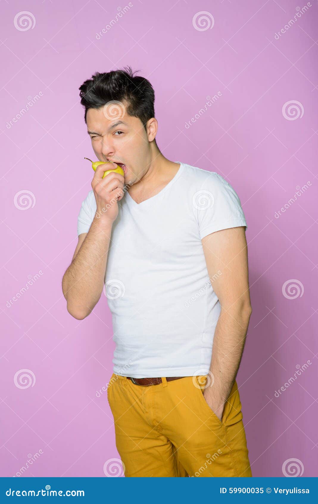 Handsome Young Man with a Pear Stock Image - Image of holding ...