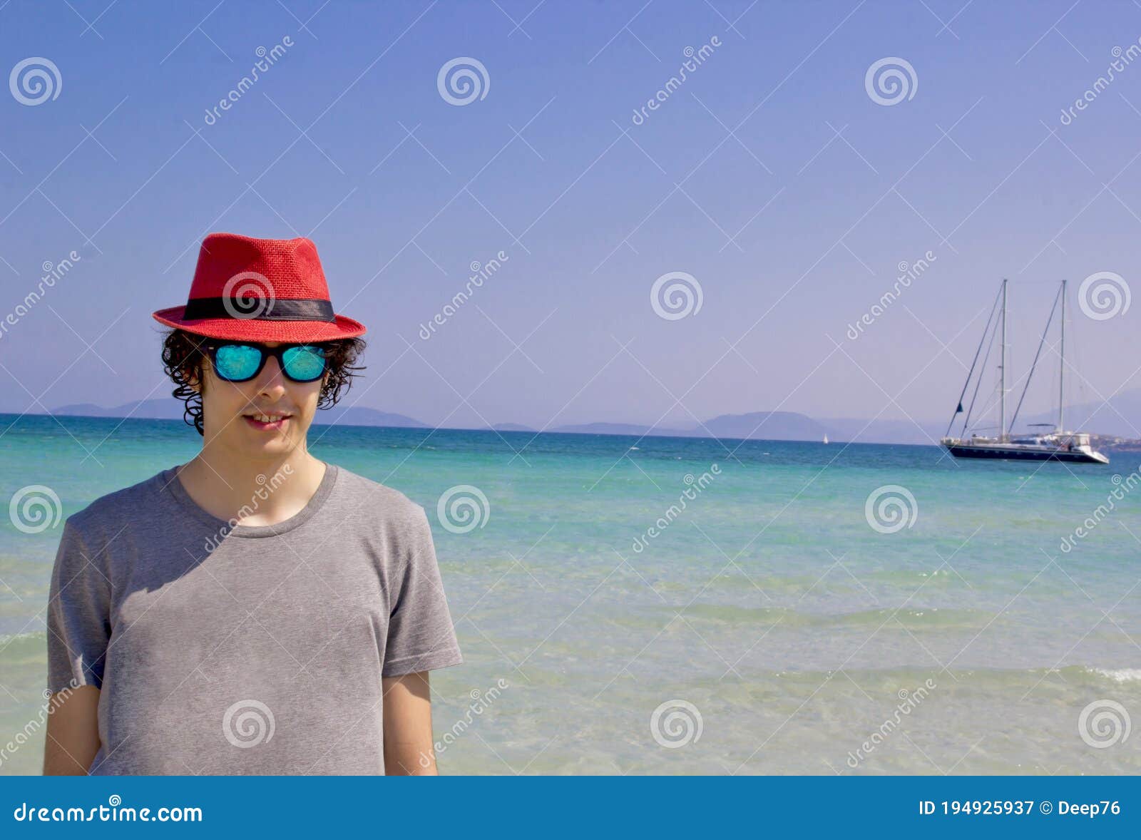 Young Man in Red Hat on the Beach Stock Image - Image of blue, white ...