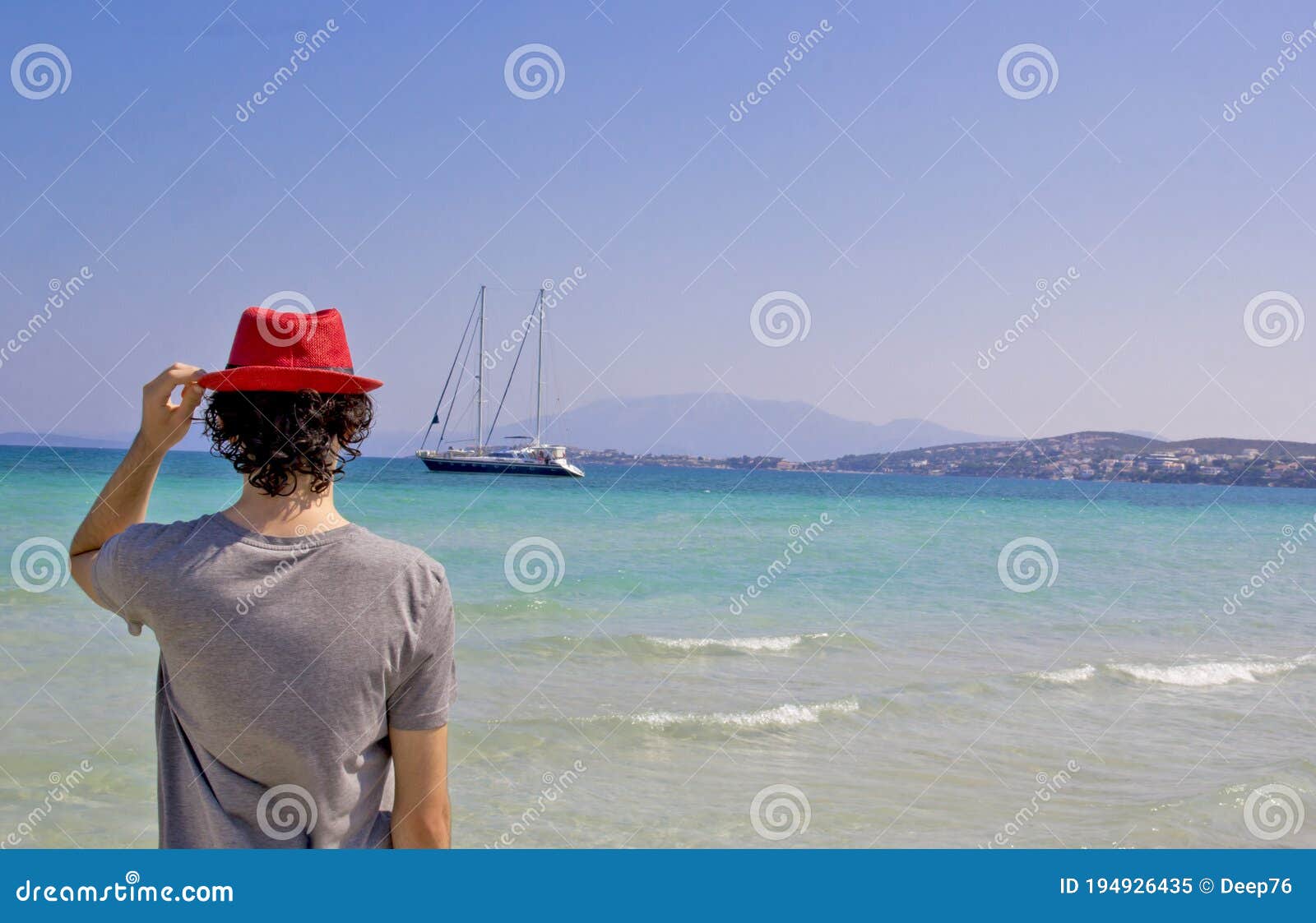 Young Man in Red Hat on the Beach Stock Image - Image of boat, coast ...