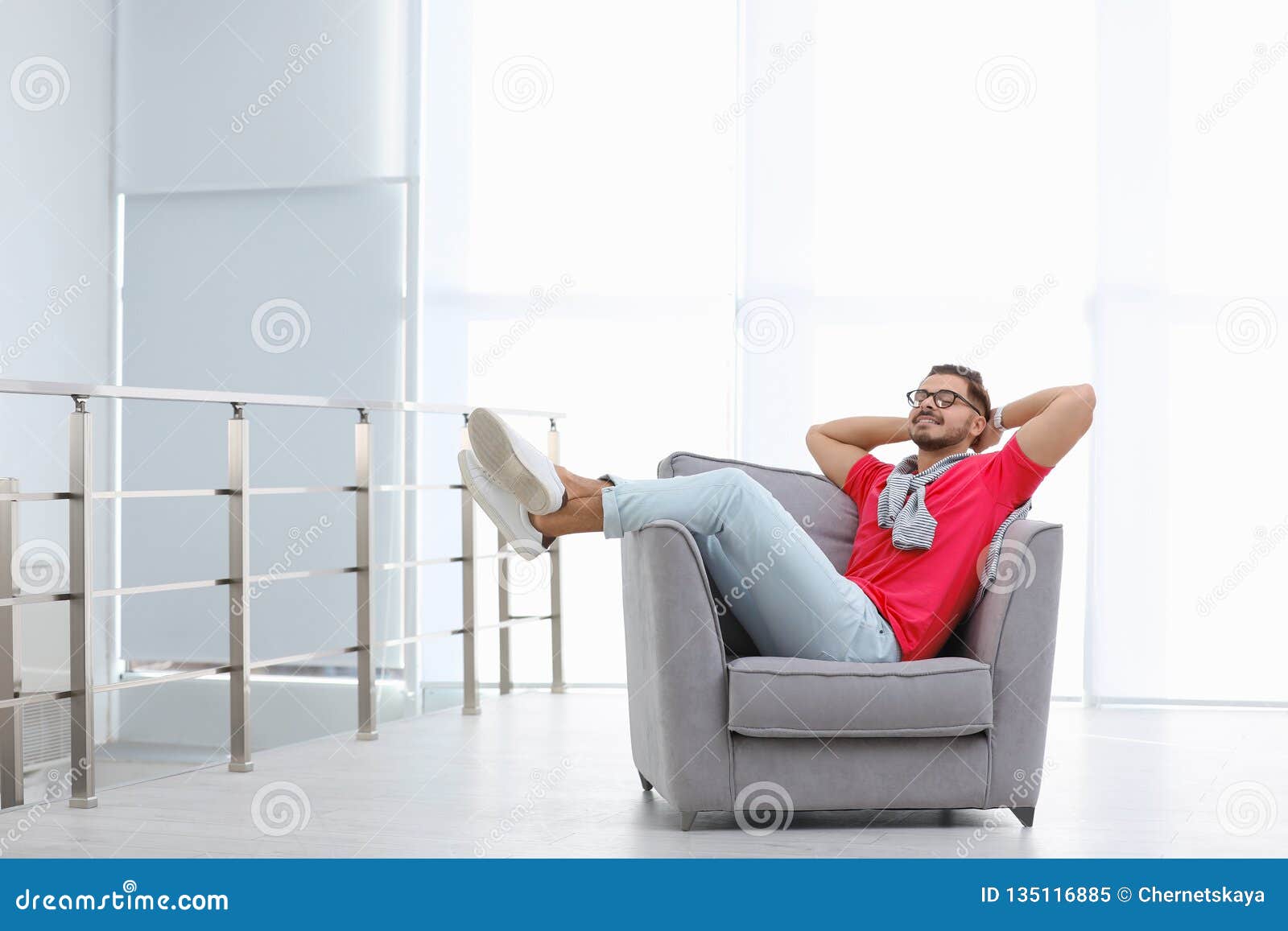 Handsome Young Man Resting in Armchair Indoors Stock Image - Image of ...