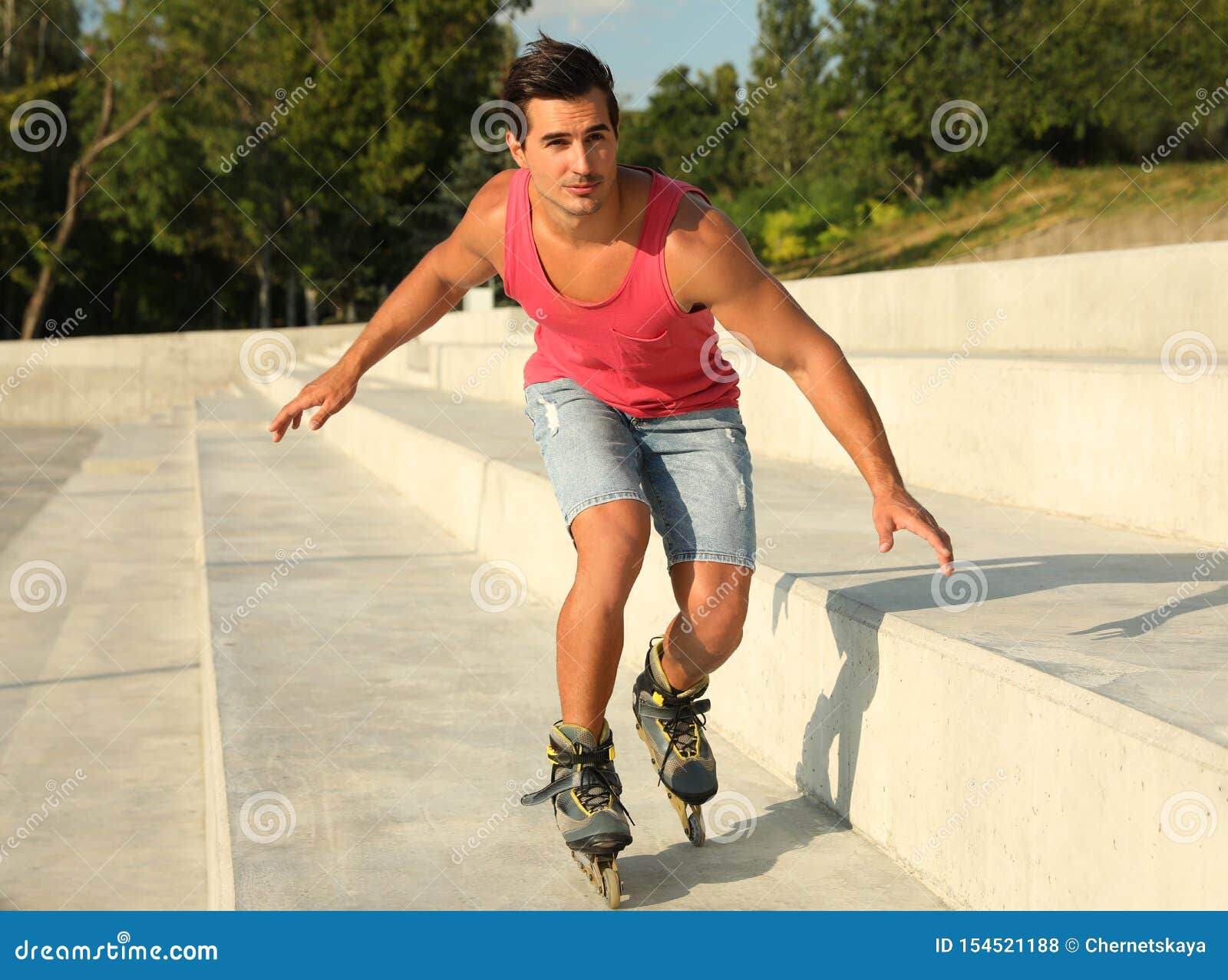Handsome Young Man Roller Skating on Street Stock Photo - Image of park ...
