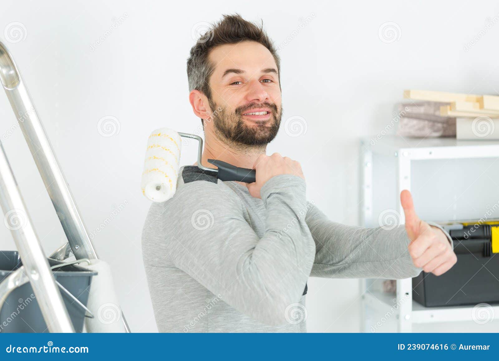 Handsome Young Man Rubbing Down Wall Stock Photo - Image of people ...