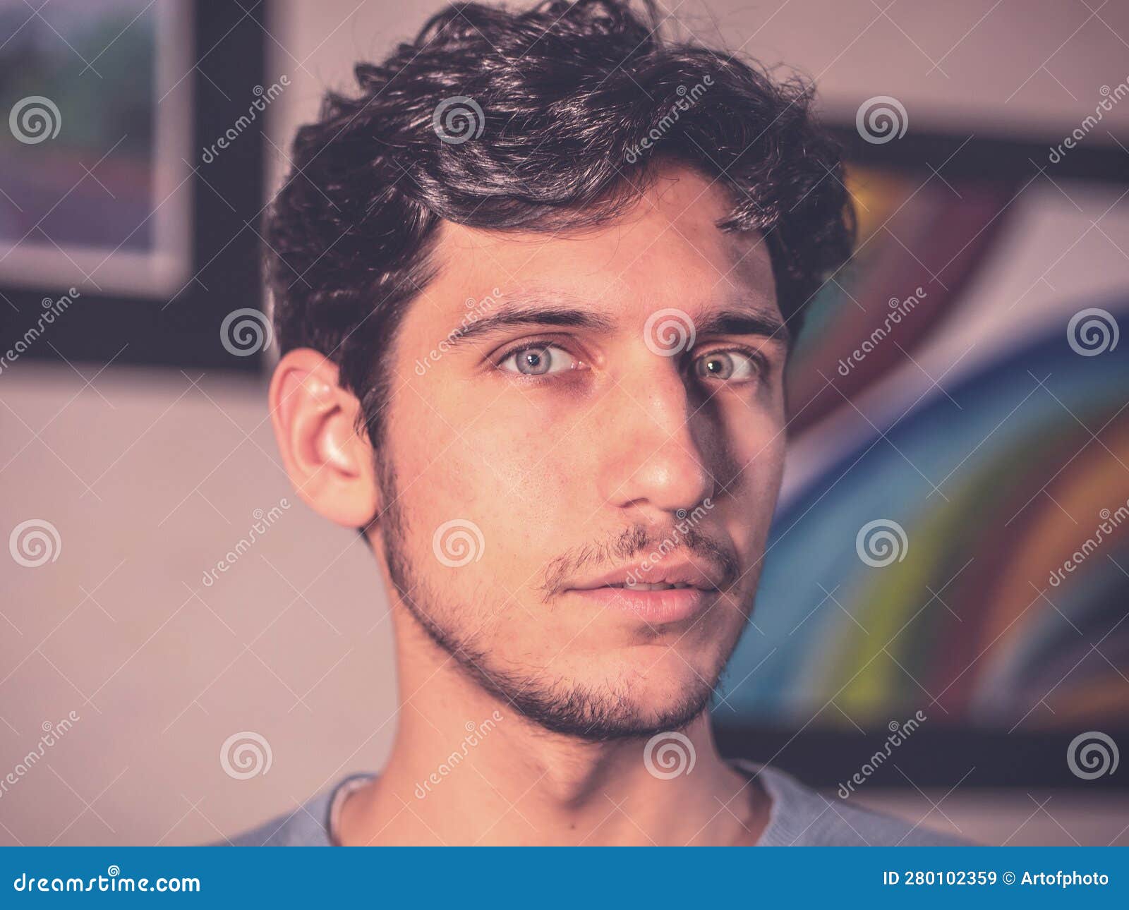 Handsome Young Man with Serious Expression at Home Stock Image - Image ...