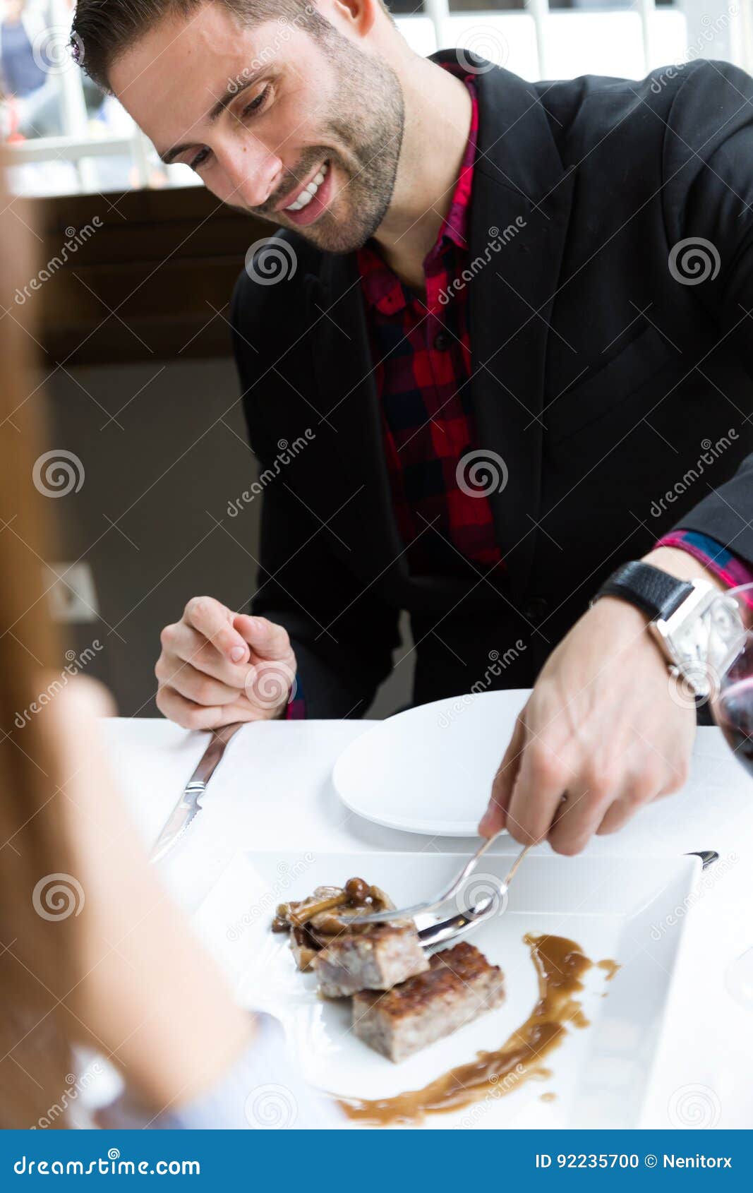 Handsome Young Man Serving Meatloaf on a Plate in the Restaurant. Stock ...