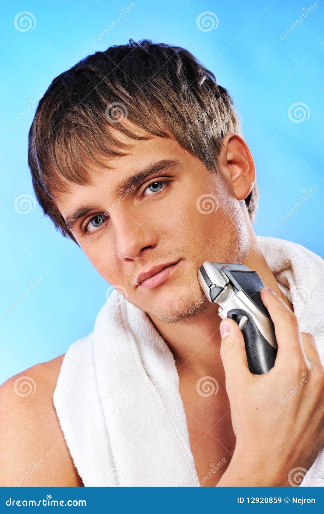 Handsome young man shaving stock image. Image of portrait - 12920859