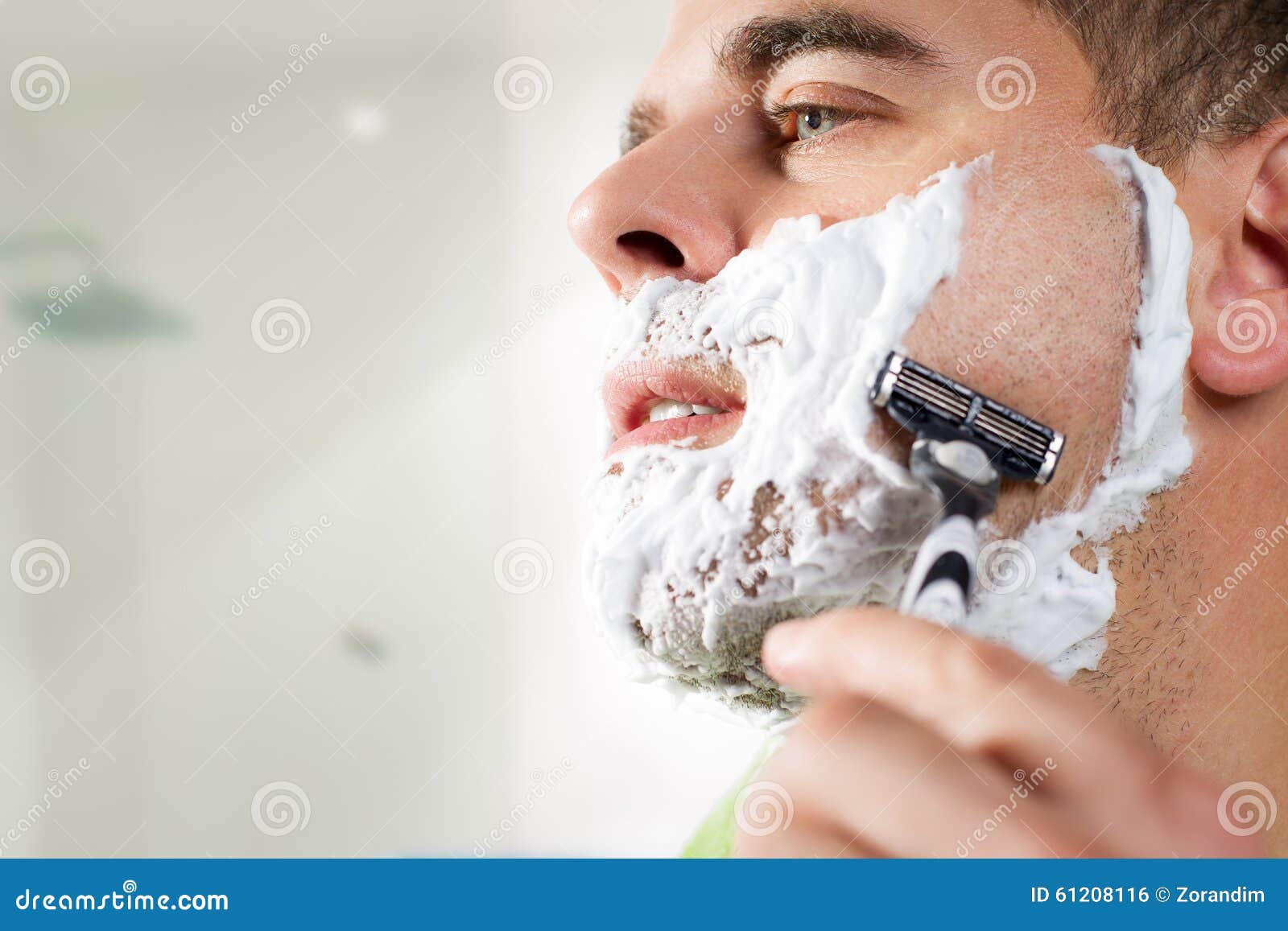 Handsome Young Man is Shaving His Face Stock Photo - Image of skin ...