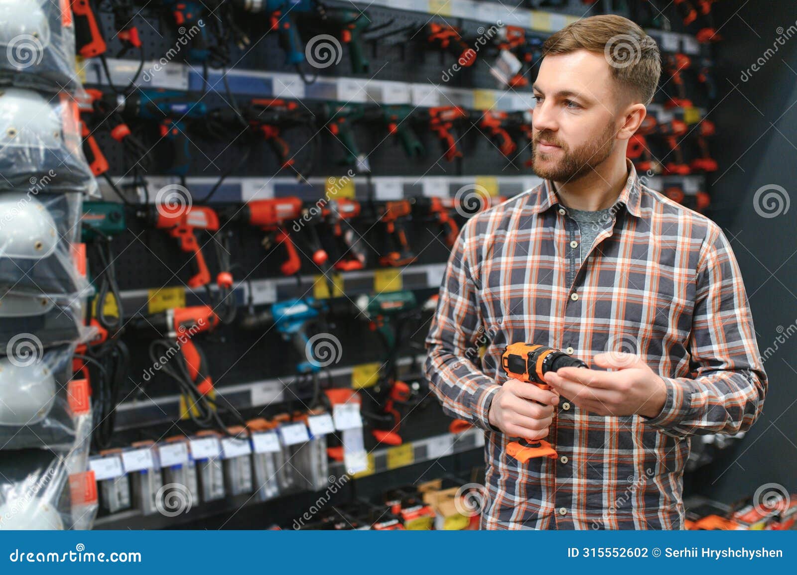 Handsome Young Man Shopping for Tools at Hardware Store Stock Photo ...