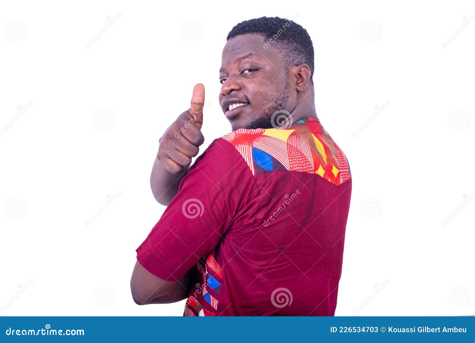 Handsome Young Man Showing His Thumb Over His Shoulder Stock Image ...