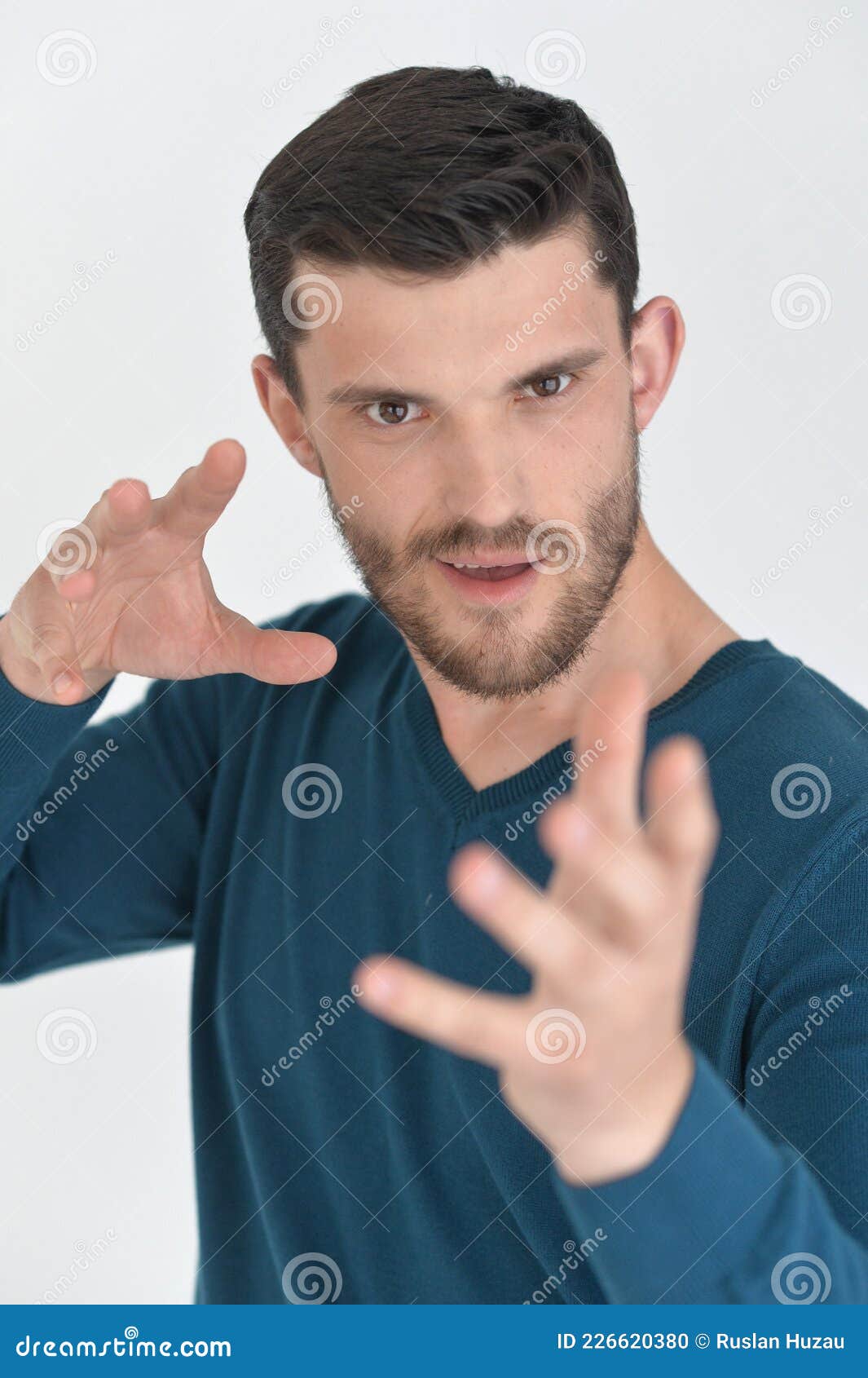 Handsome Young Man Showing Something in Studio Stock Photo - Image of ...