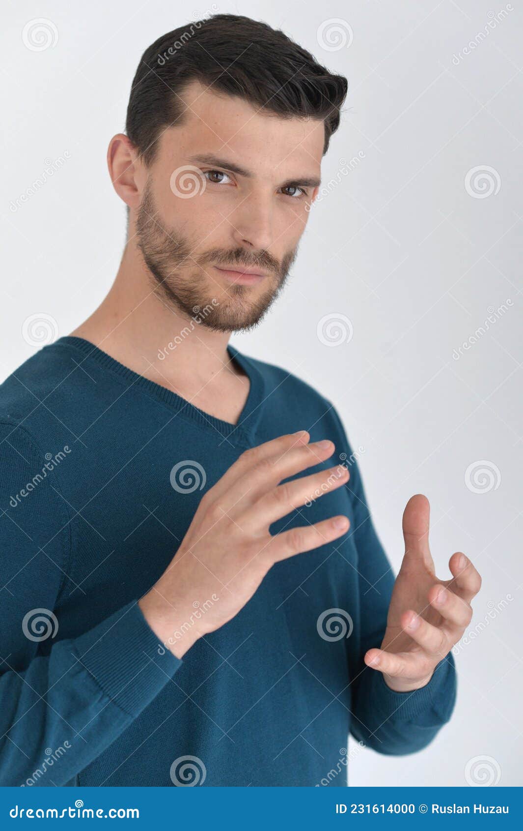 Handsome Young Man Showing Something in Studio Stock Photo - Image of ...