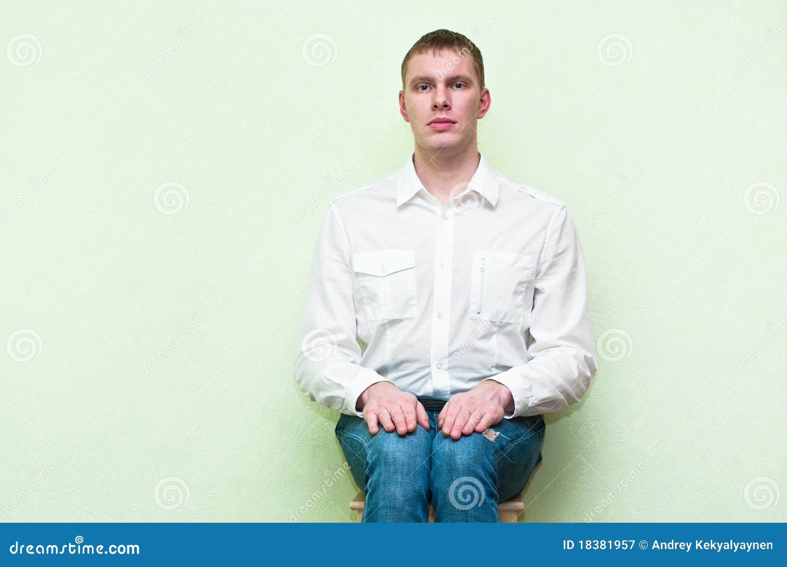 Handsome young man sitting stock image. Image of creativity - 18381957
