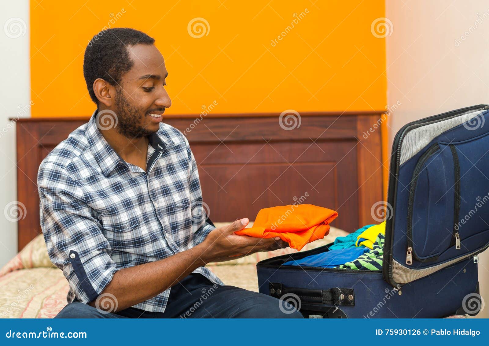 Man Packing Suitcase