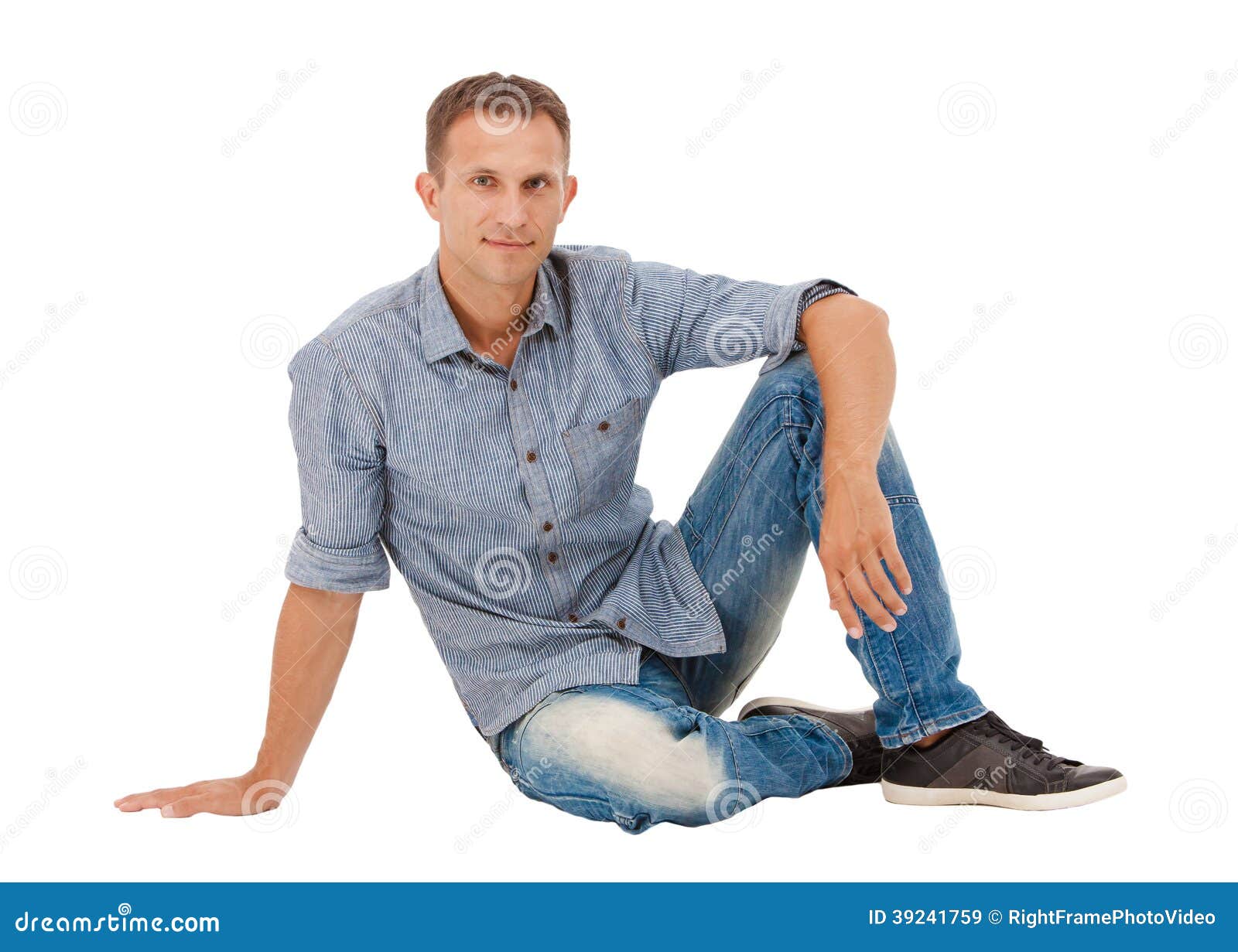 A Handsome Young Man Sitting on the Floor Stock Image - Image of jeans ...