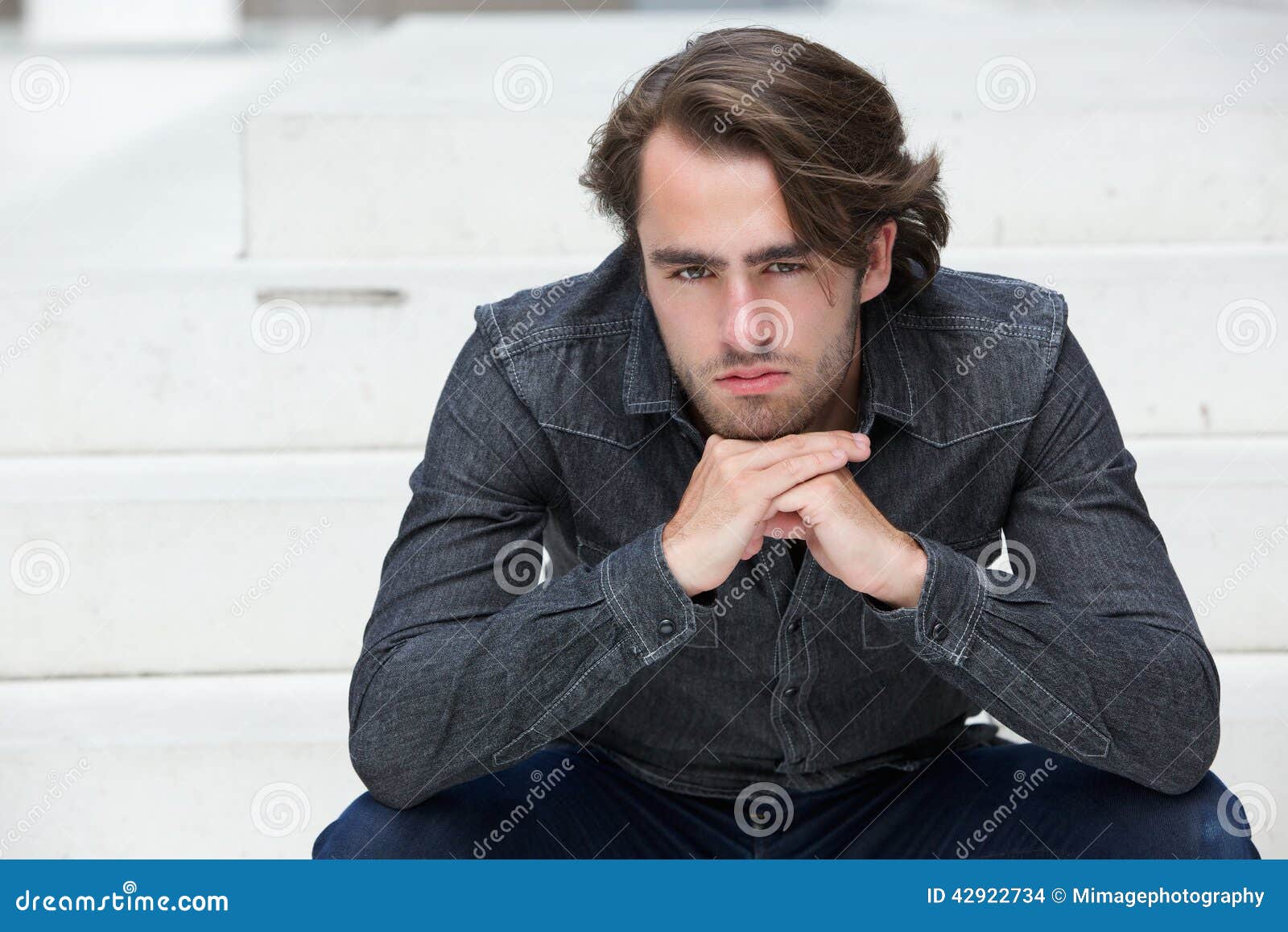 Handsome Young Man Sitting Outside Stock Photo - Image of closeup, hand ...
