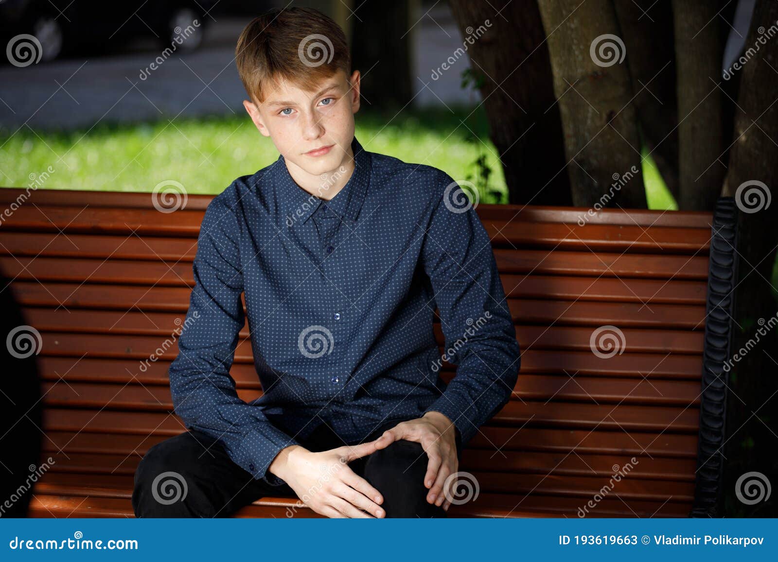 Handsome Young Man Sitting on a Park Bench Stock Image - Image of ...