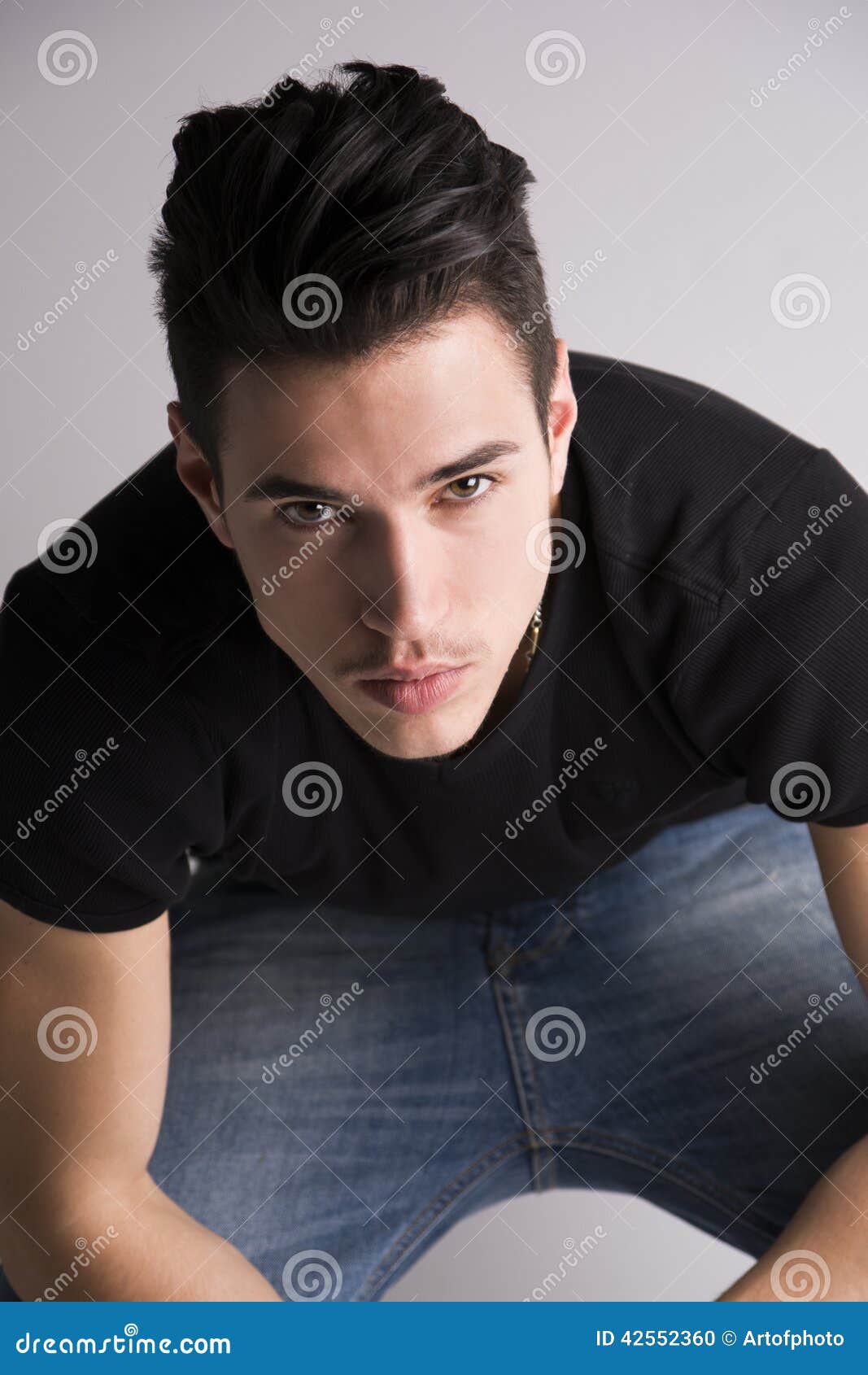 Handsome Young Man Sitting, Seen from Above Stock Photo - Image of ...