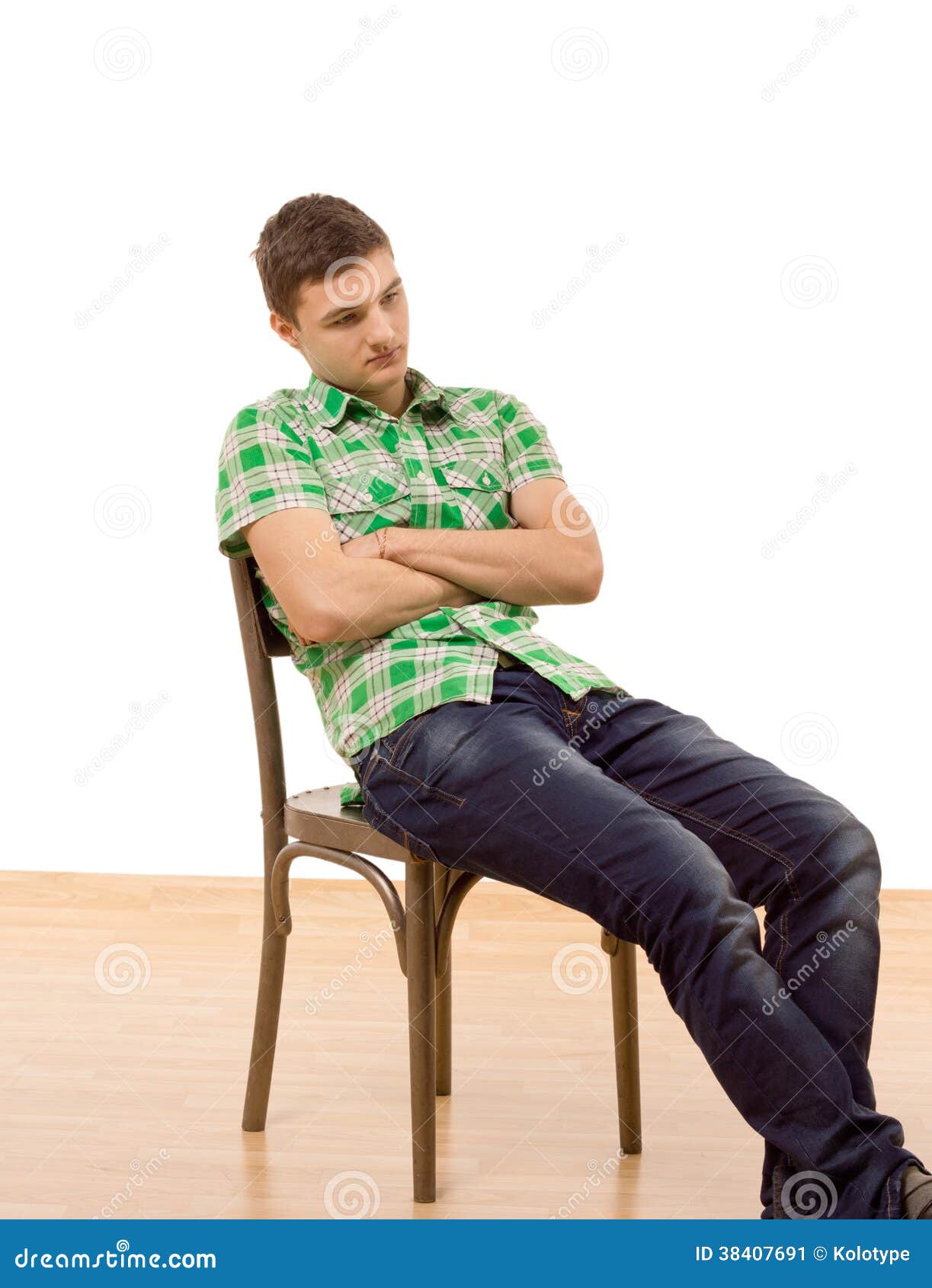 Handsome Young Man Sitting Slumped in a Chair Stock Image - Image of ...