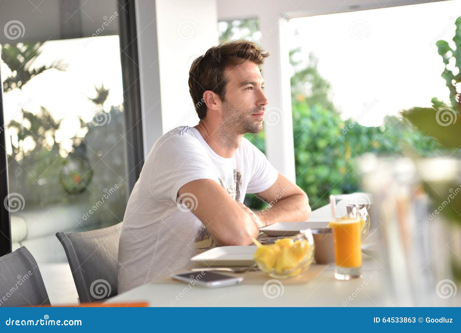 Handsome Young Man Sitting at the Table Having Breakfast Stock Image ...