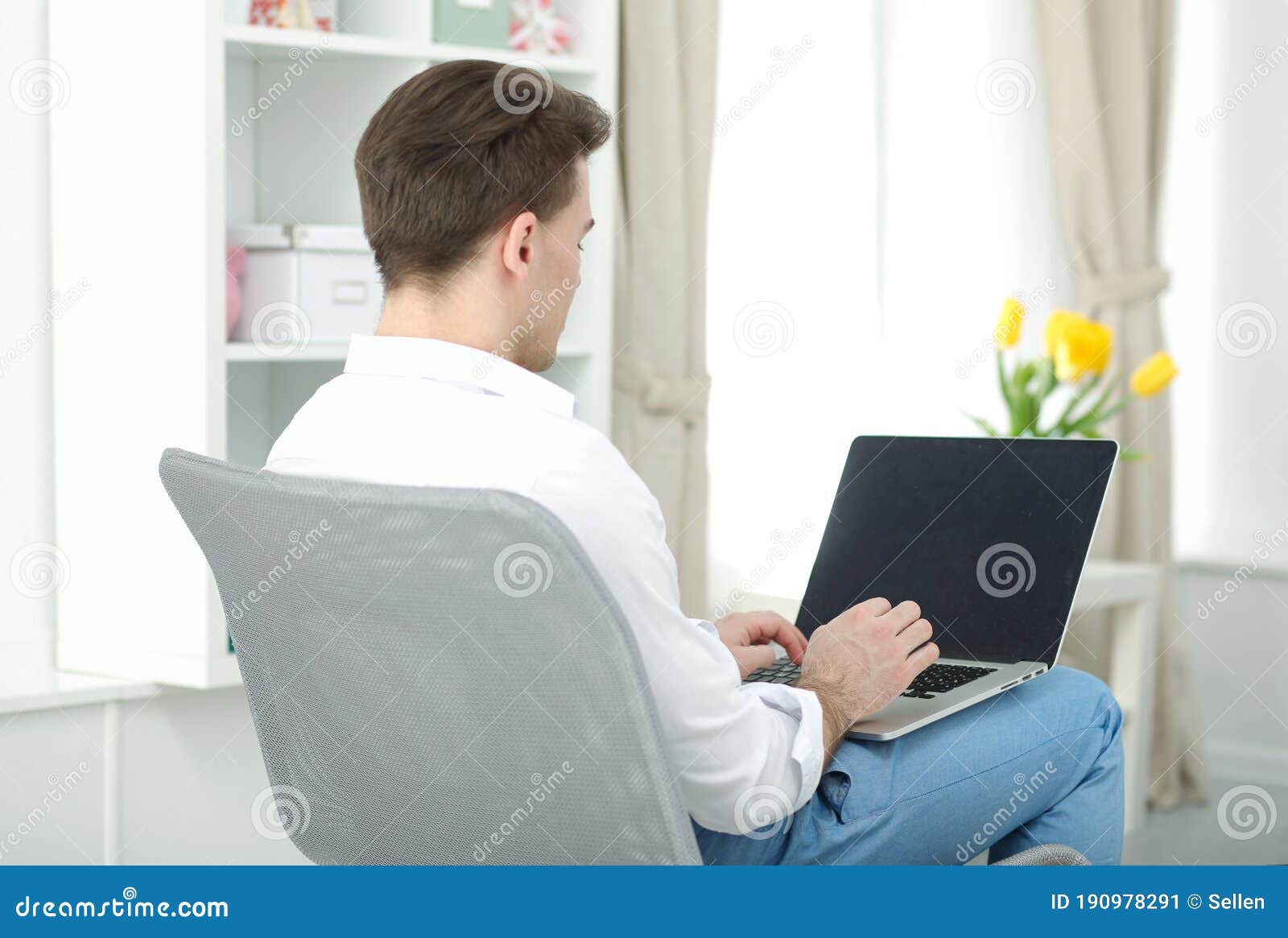 Handsome Young Man Sitting and Working on Laptop Computer Stock Image ...