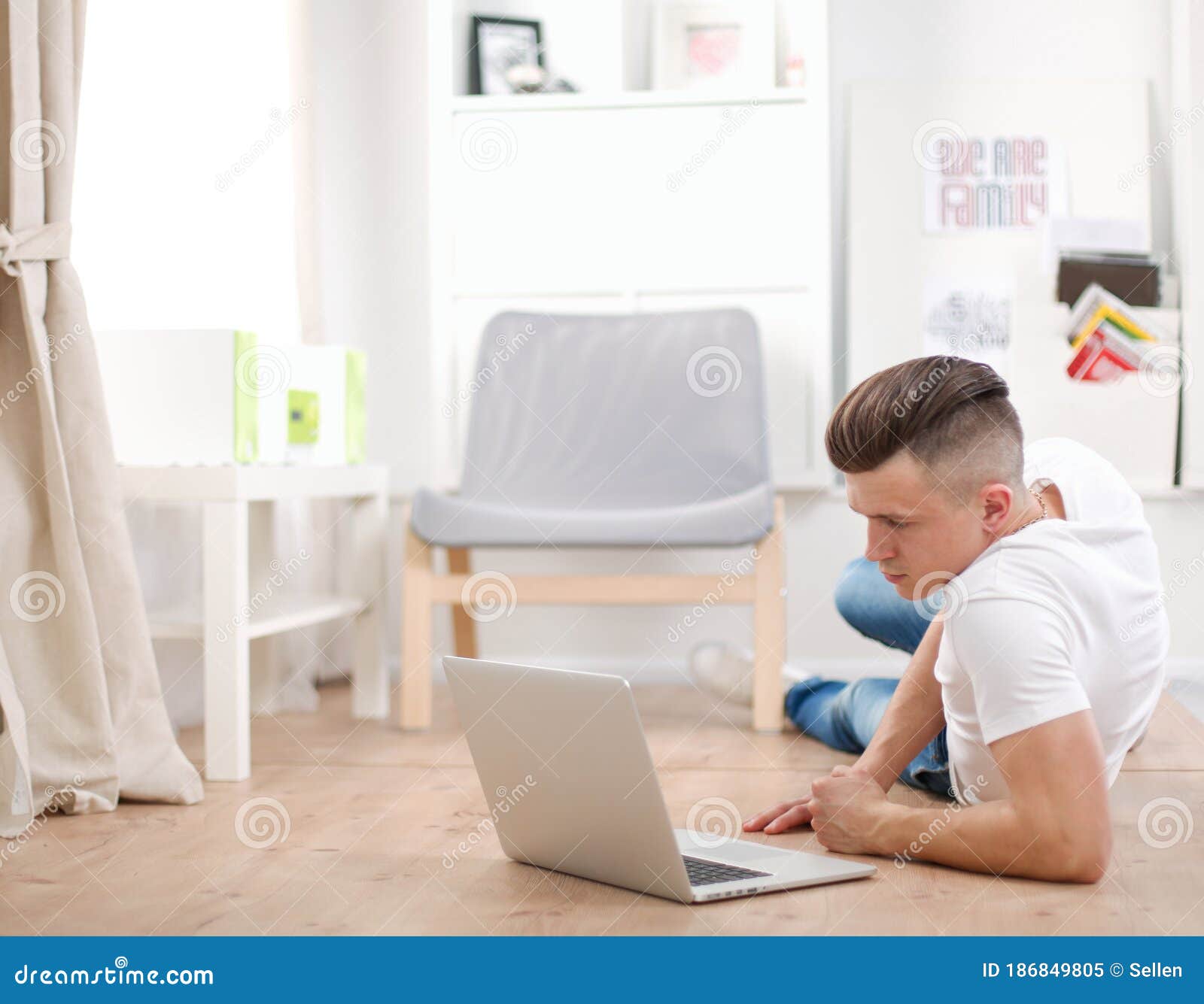 Handsome Young Man Sitting and Working on Laptop Computer Stock Image ...