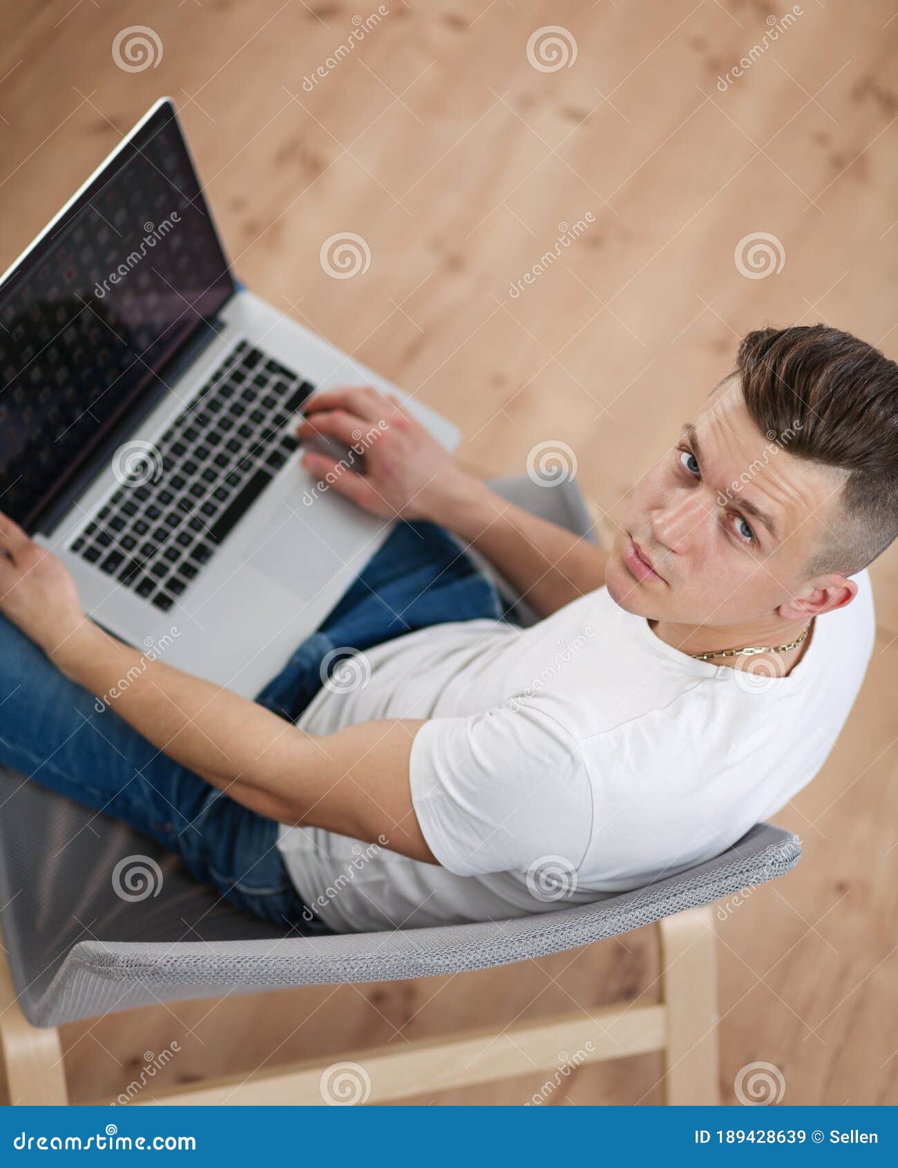 Handsome Young Man Sitting and Working on Laptop Computer Stock Image ...
