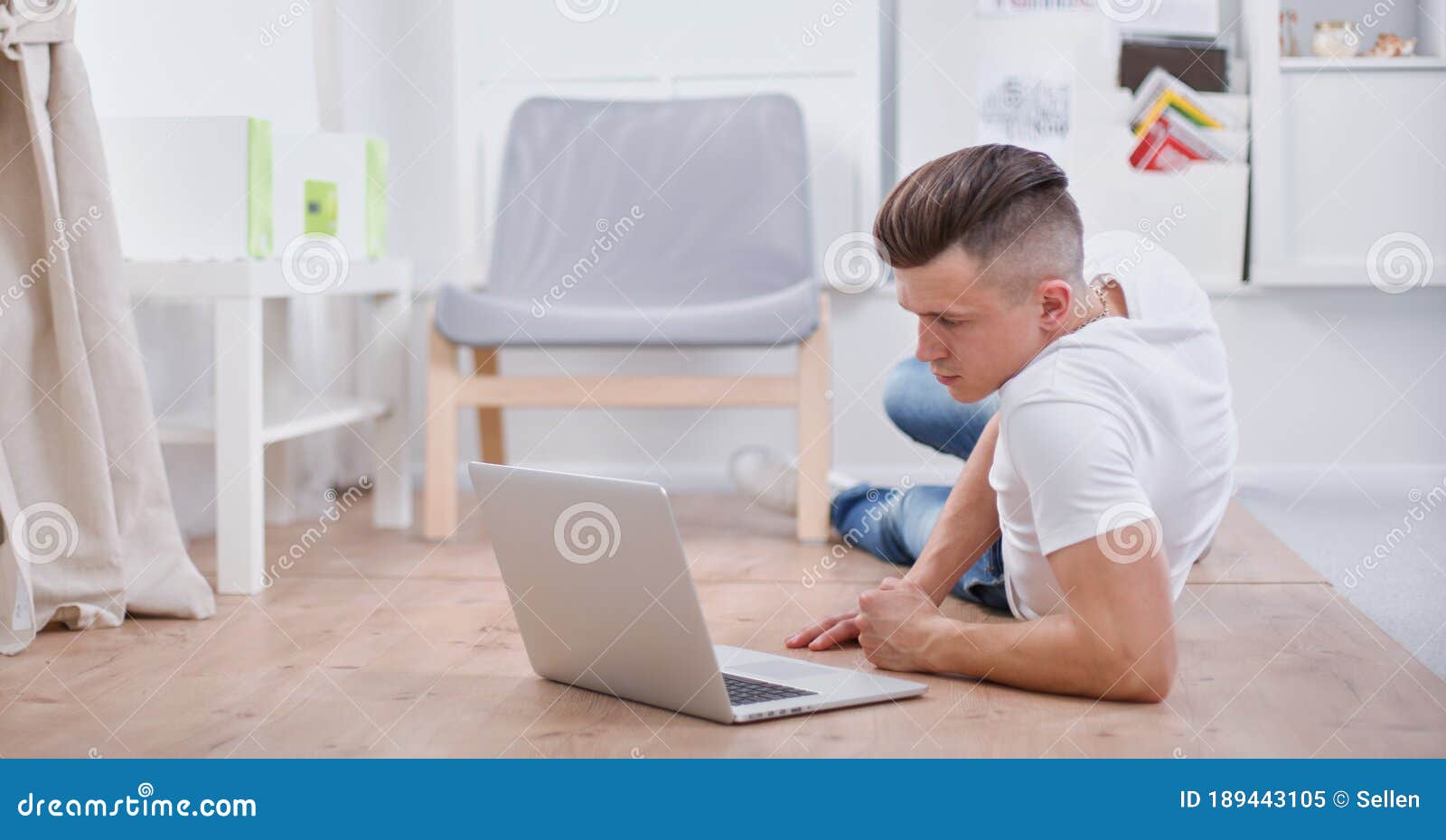 Handsome Young Man Sitting and Working on Laptop Computer Stock Image ...