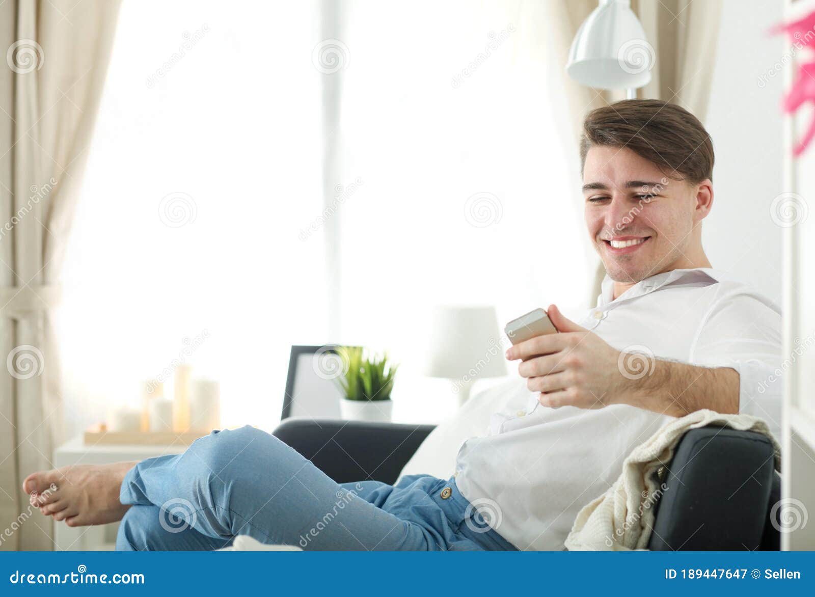 Handsome Young Man Sitting and Working on Laptop Computer Stock Image ...