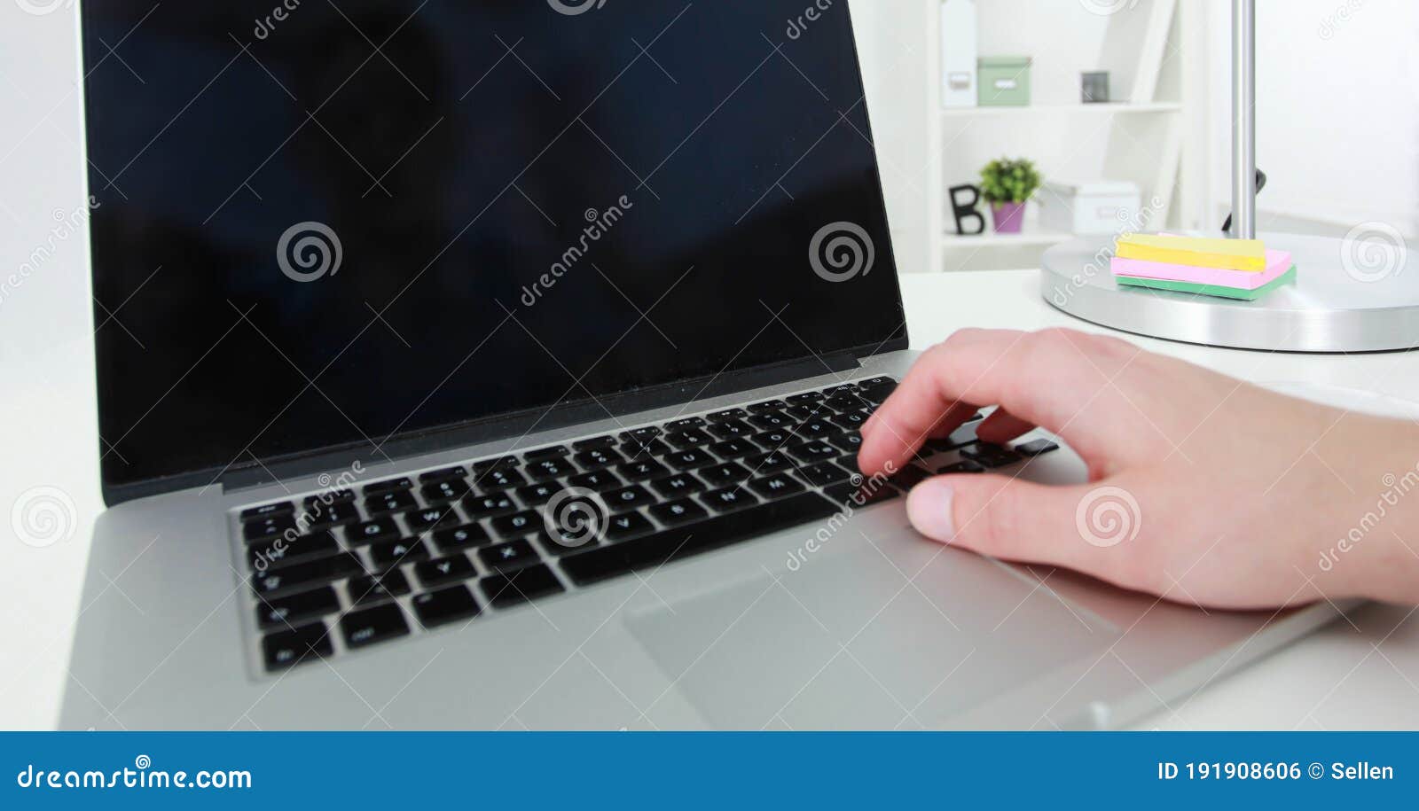 Handsome Young Man Sitting and Working on Laptop Computer Stock Photo ...