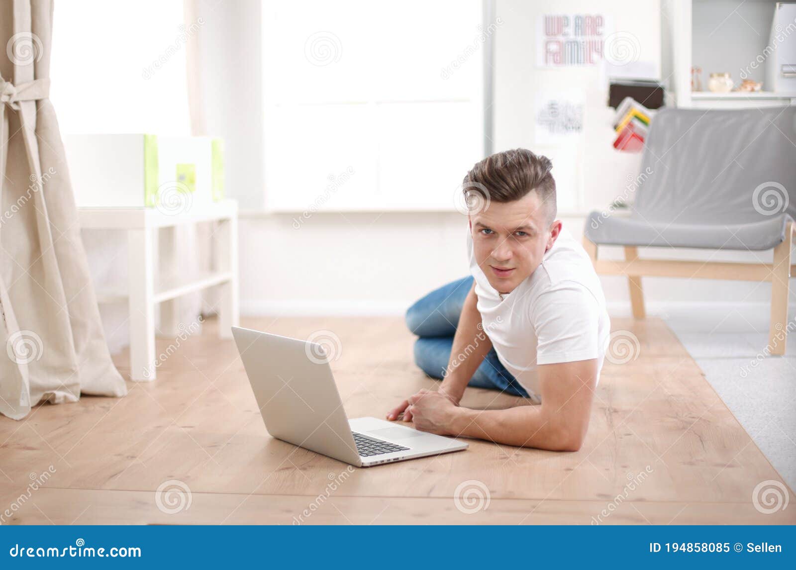 Handsome Young Man Sitting and Working on Laptop Computer Stock Image ...