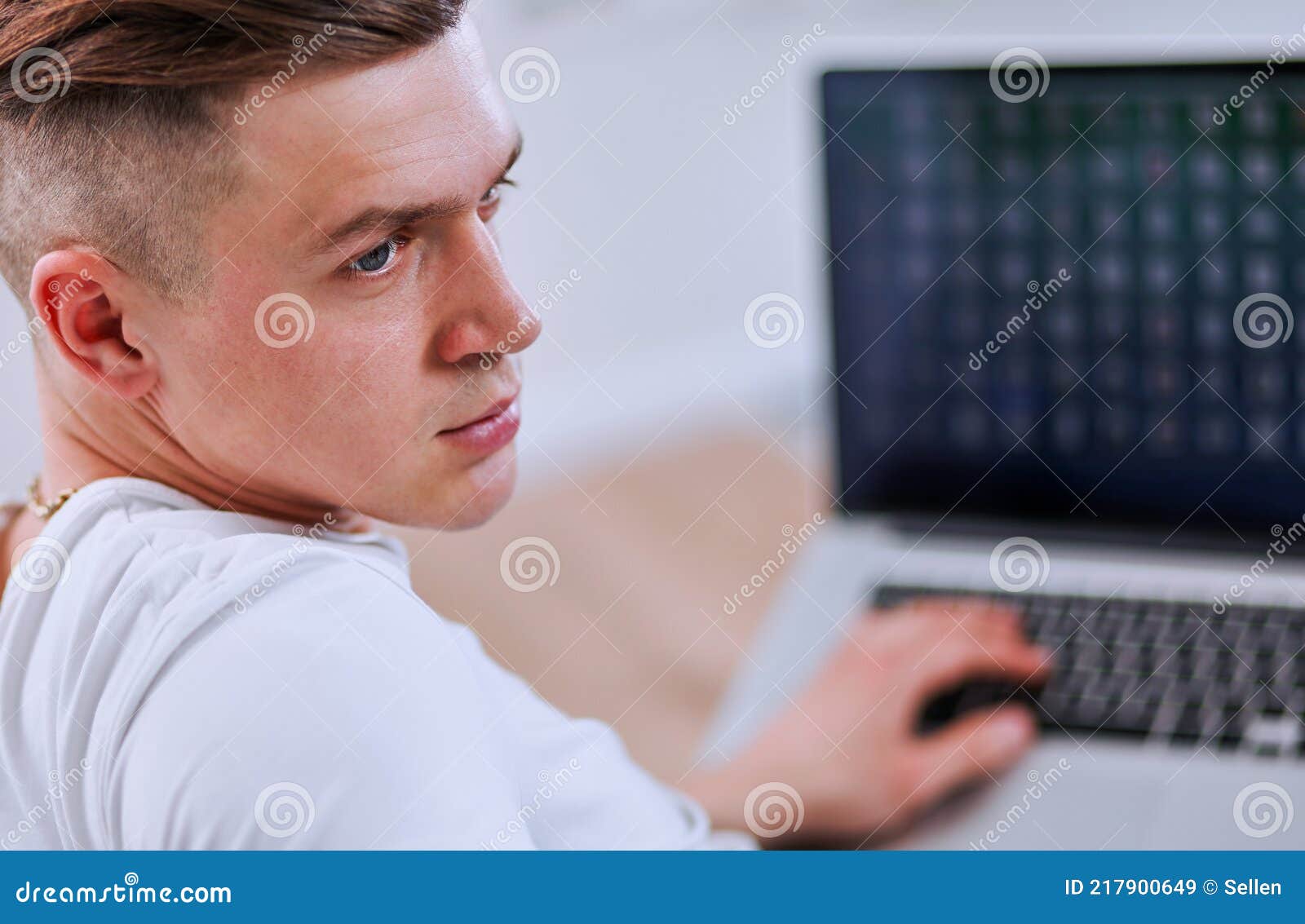 Handsome Young Man Sitting and Working on Laptop Computer Stock Image ...