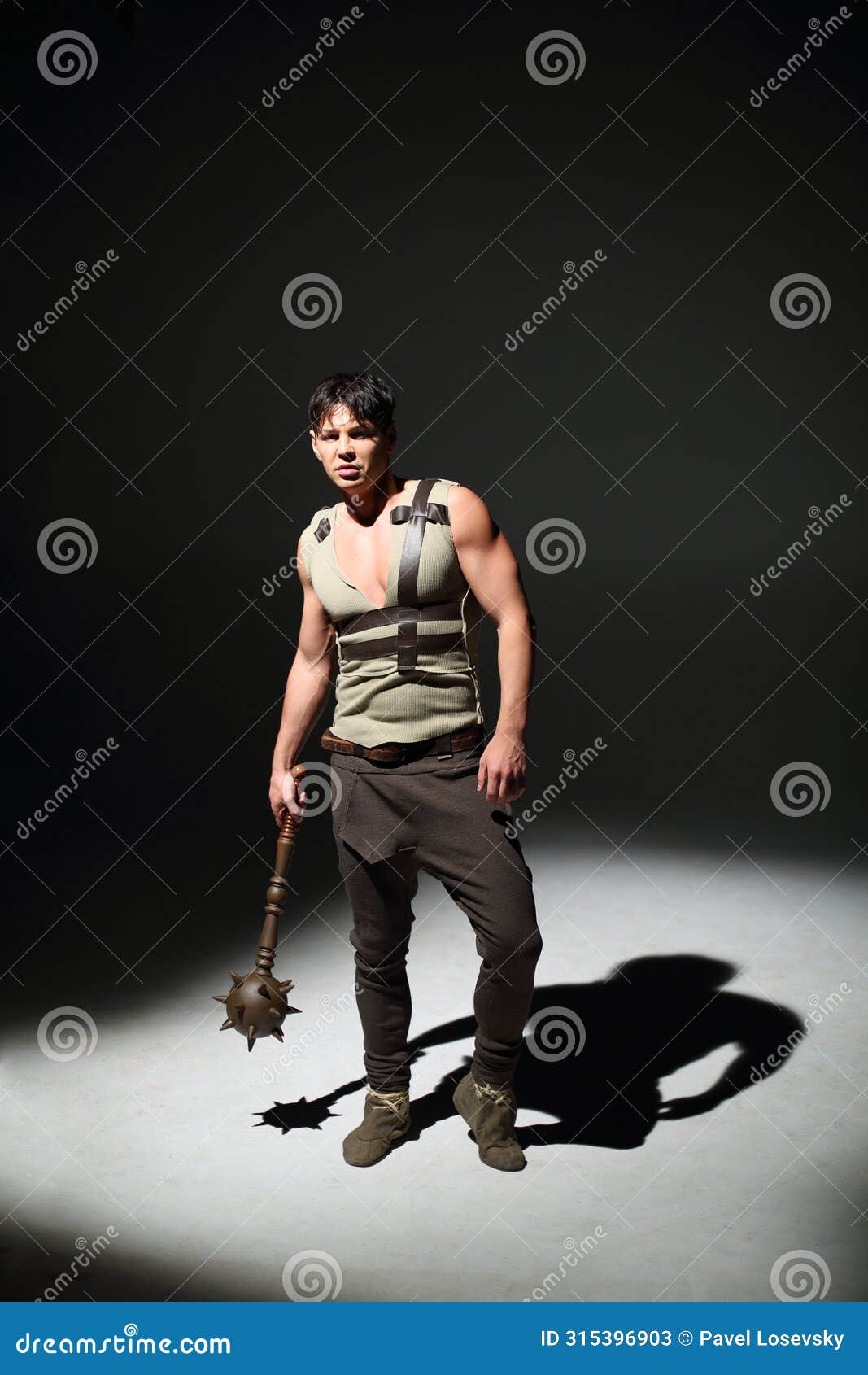 Handsome Young Man Standing with a Mace in Stock Image - Image of ...