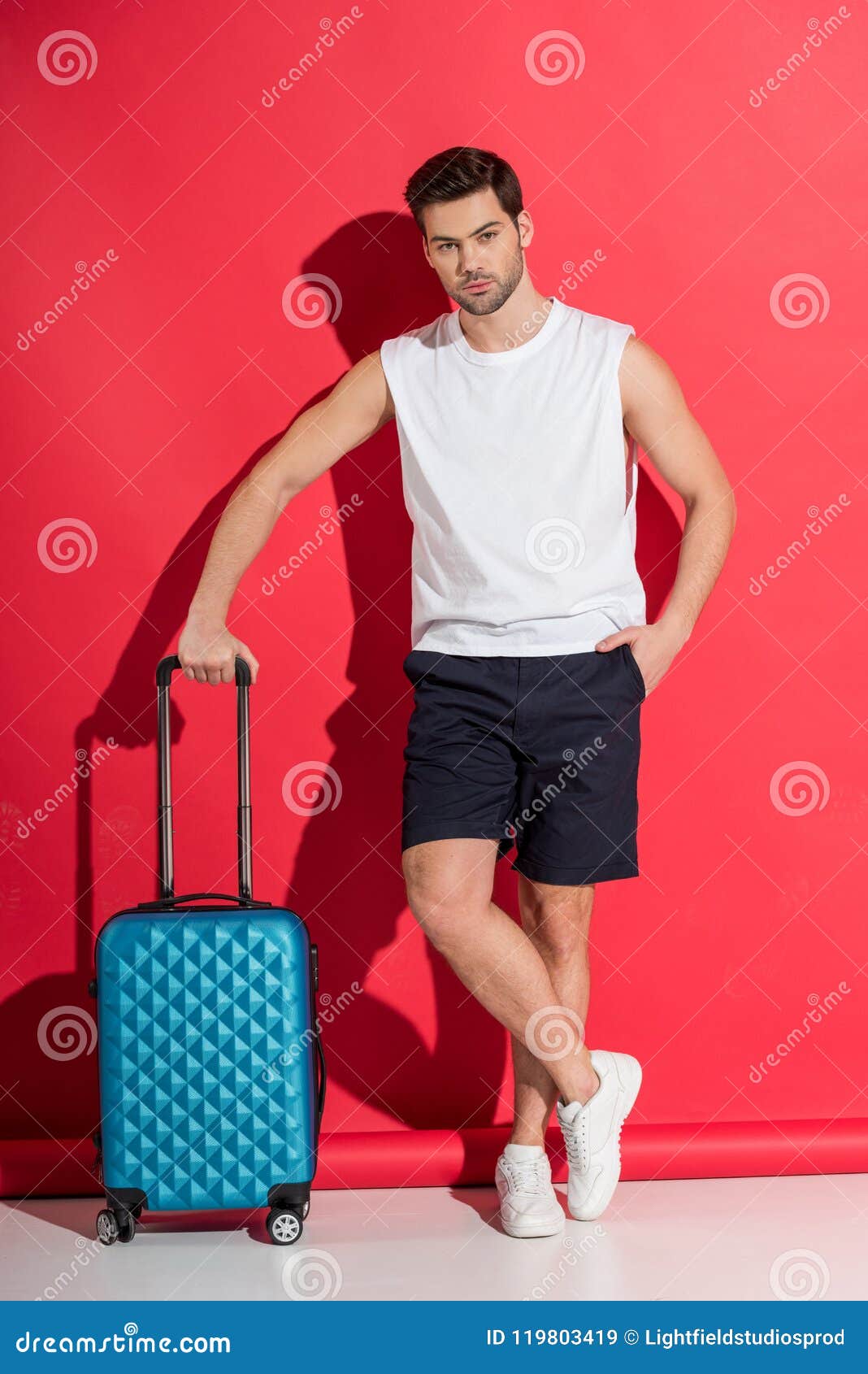 Handsome Young Man Standing with Suitcase and Looking at Camera Stock ...