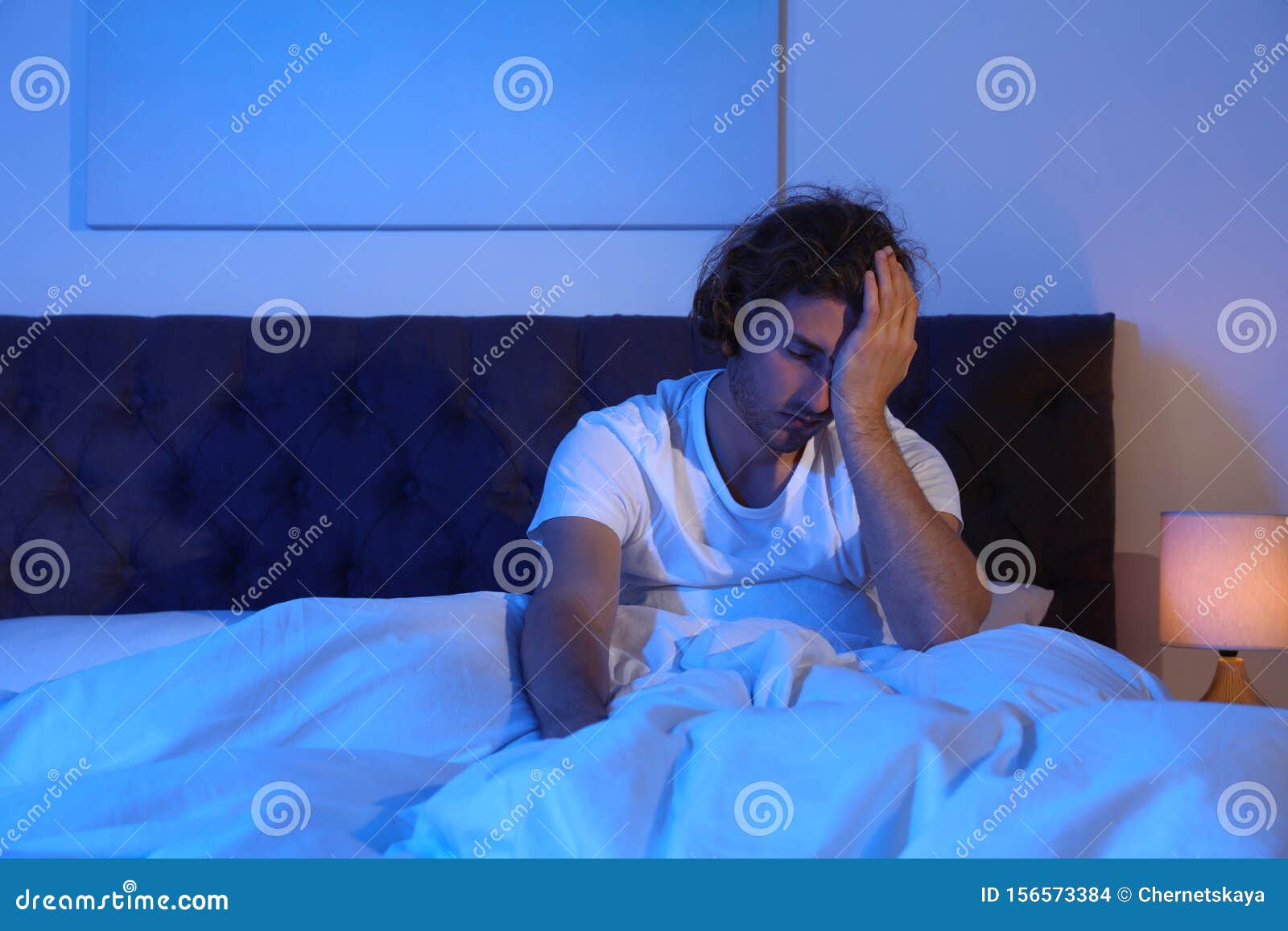 Handsome Young Man Suffering from Insomnia in Dark Room at Night Stock ...