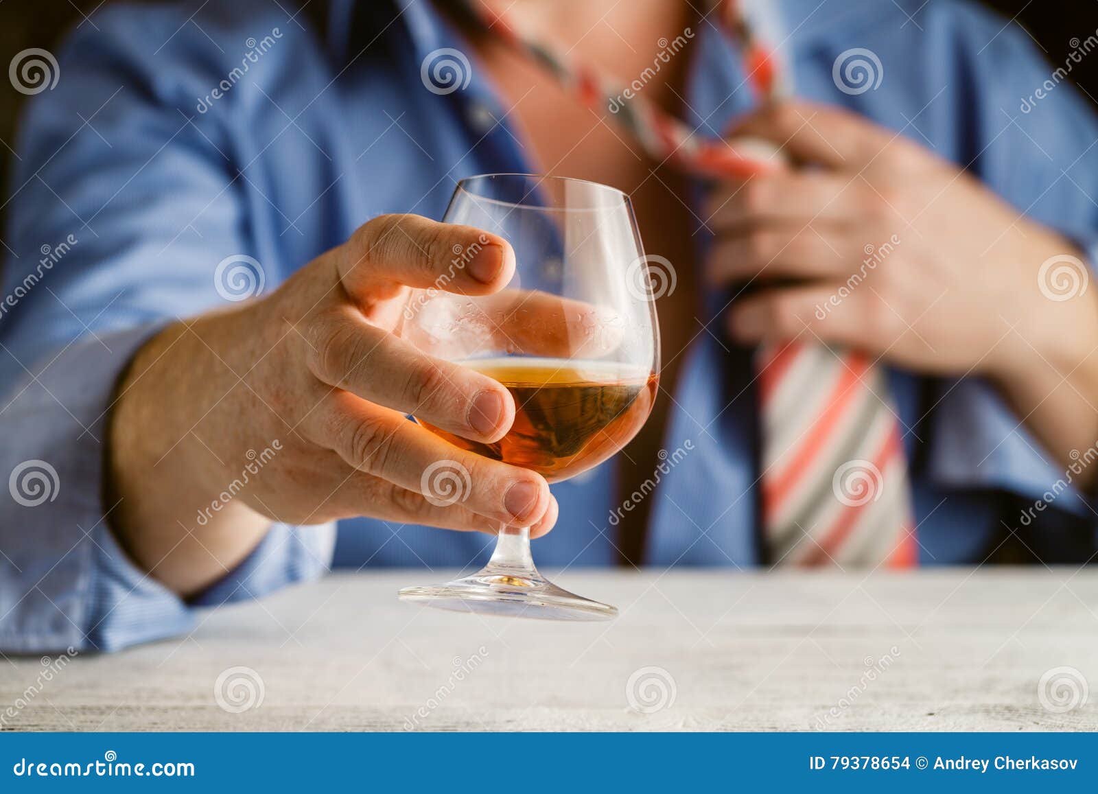 Handsome Young Man in Suit Tasting with Glass of Alcohol Stock Photo ...
