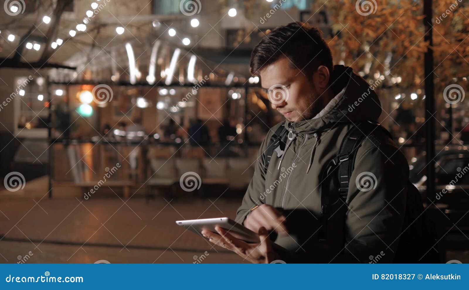 Handsome Young Man with Tablet Pc Navigating in the Night Streets Stock ...