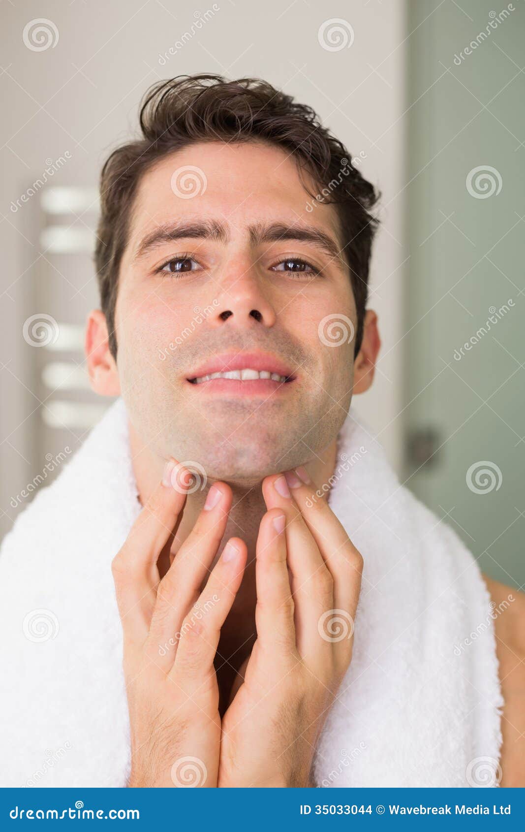 Handsome Young Man Touching His Face Stock Photo - Image of face ...