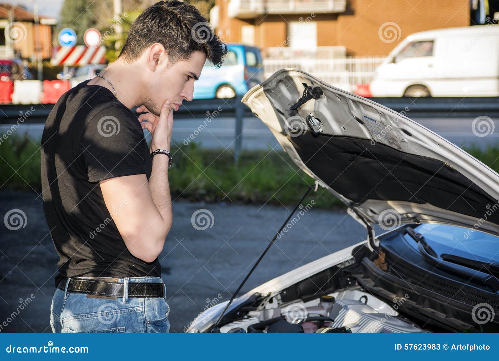 Handsome Young Man Trying To Repair a Car Engine Stock Image - Image of ...